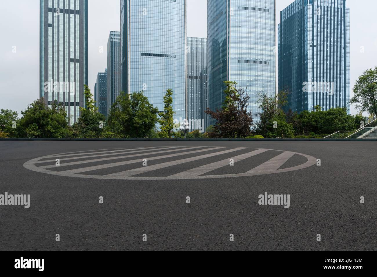 A low-angle shot of an empty ground floor in front of modern office ...