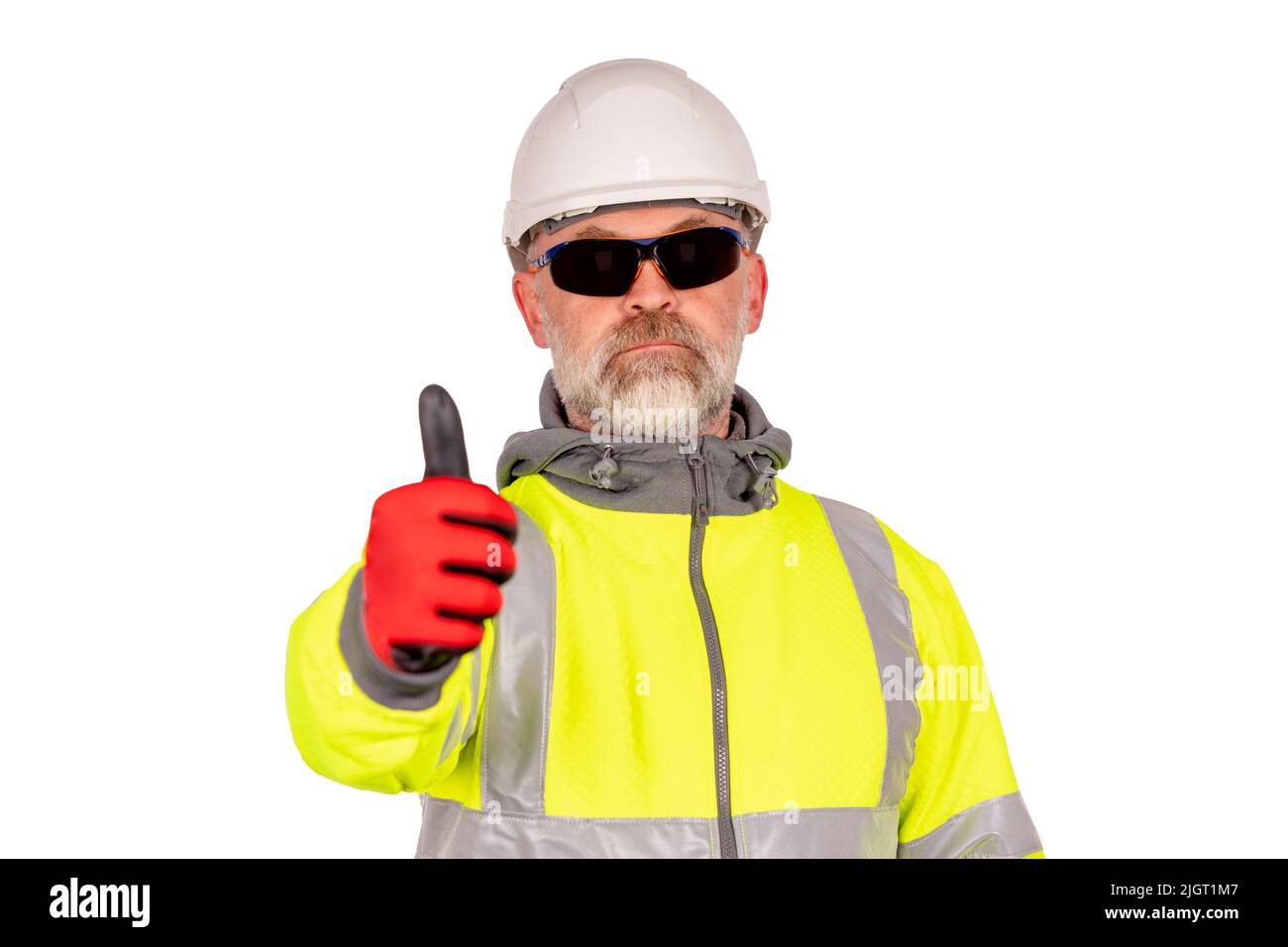 A builder in a white hard hat, bright yellow reflective hi-visibility ...