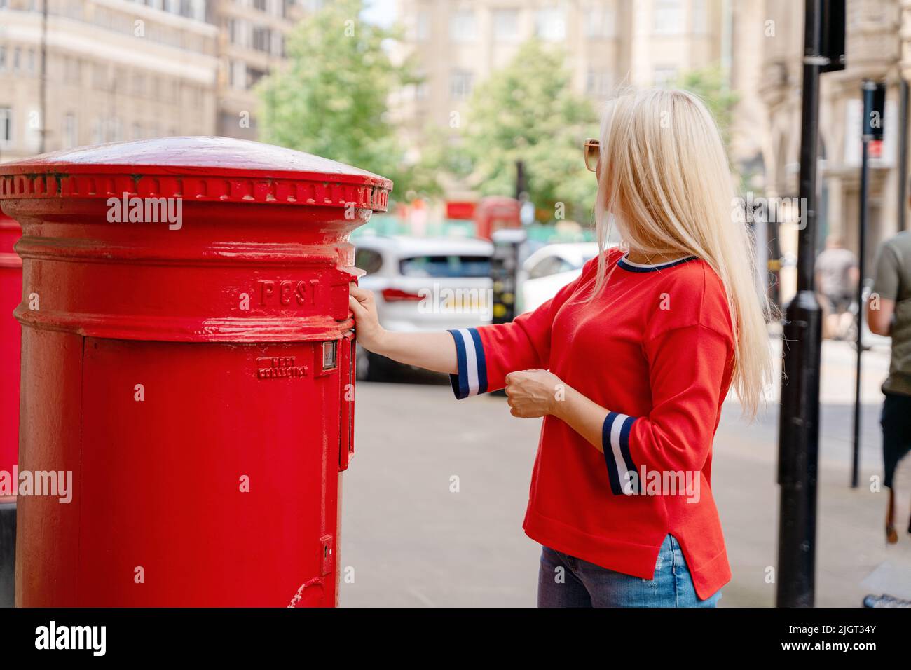 Posting letter uk girl hi-res stock photography and images - Alamy