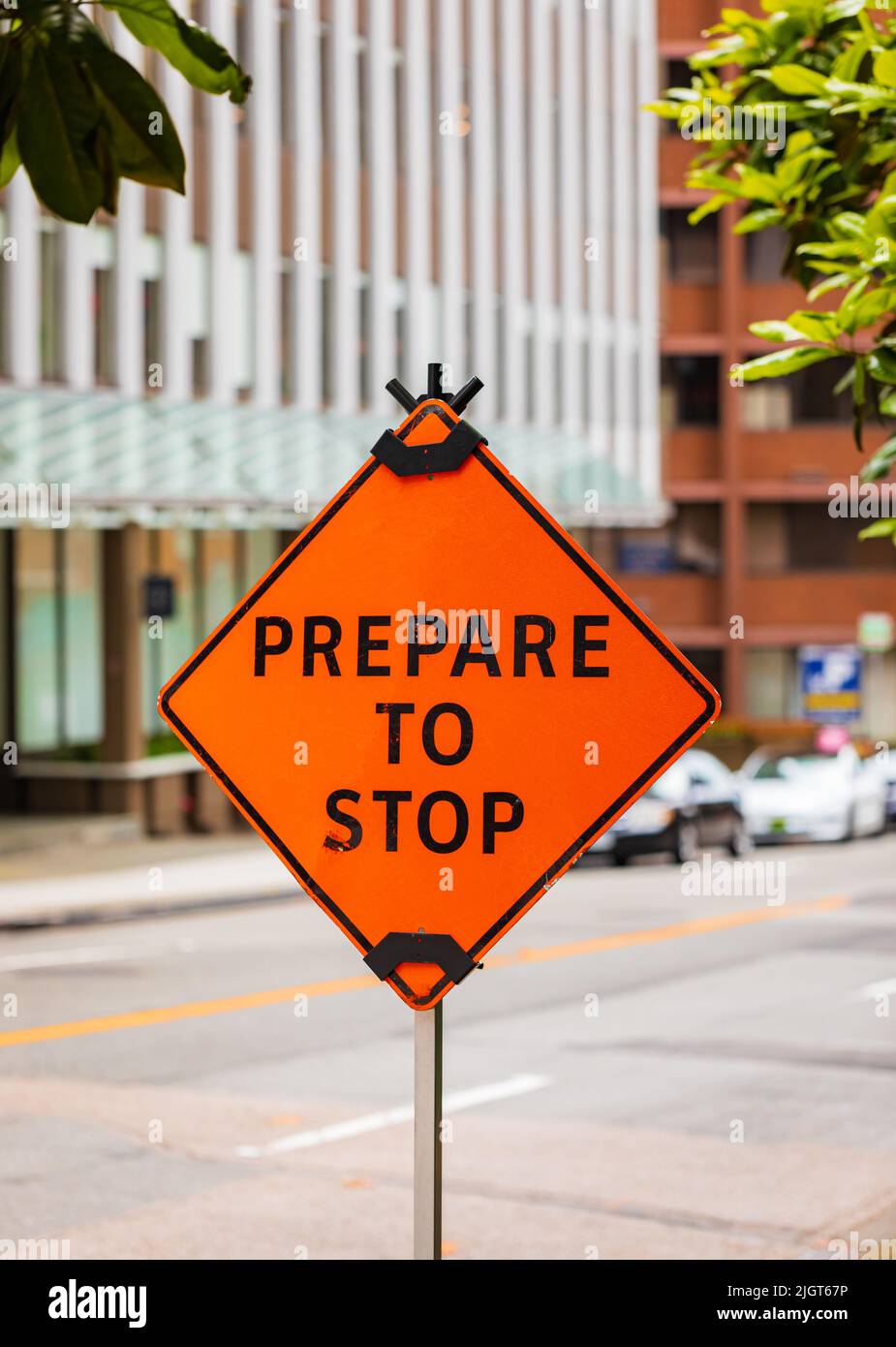 A road construction sign warns oncoming traffic and motorists. Prepare ...