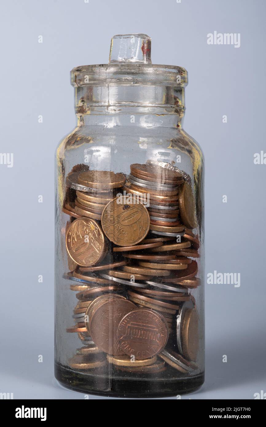 glass jar full of real coins (R$), front view Stock Photo - Alamy