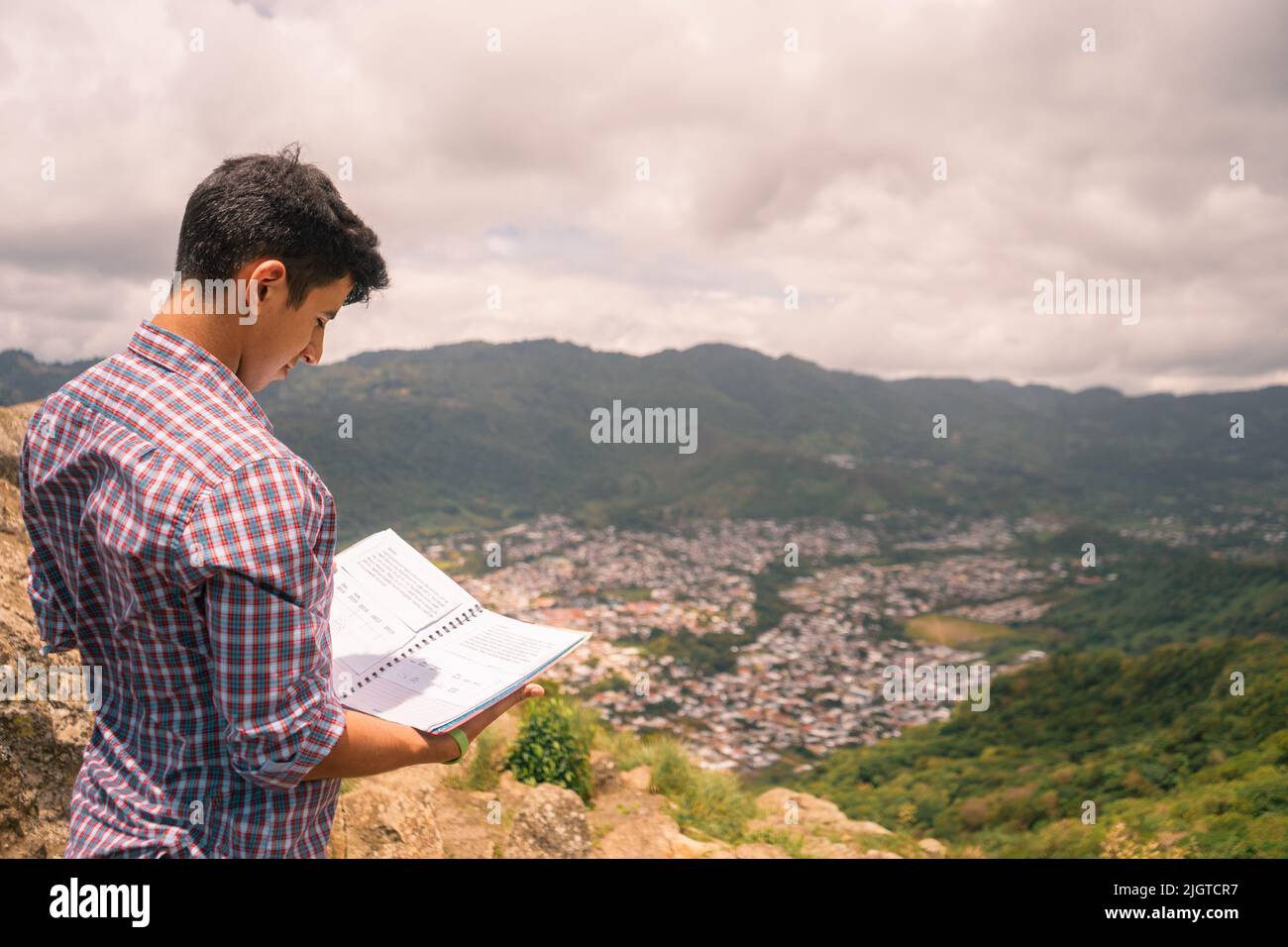 Self-taught Latin student studying alone and calm Stock Photo - Alamy