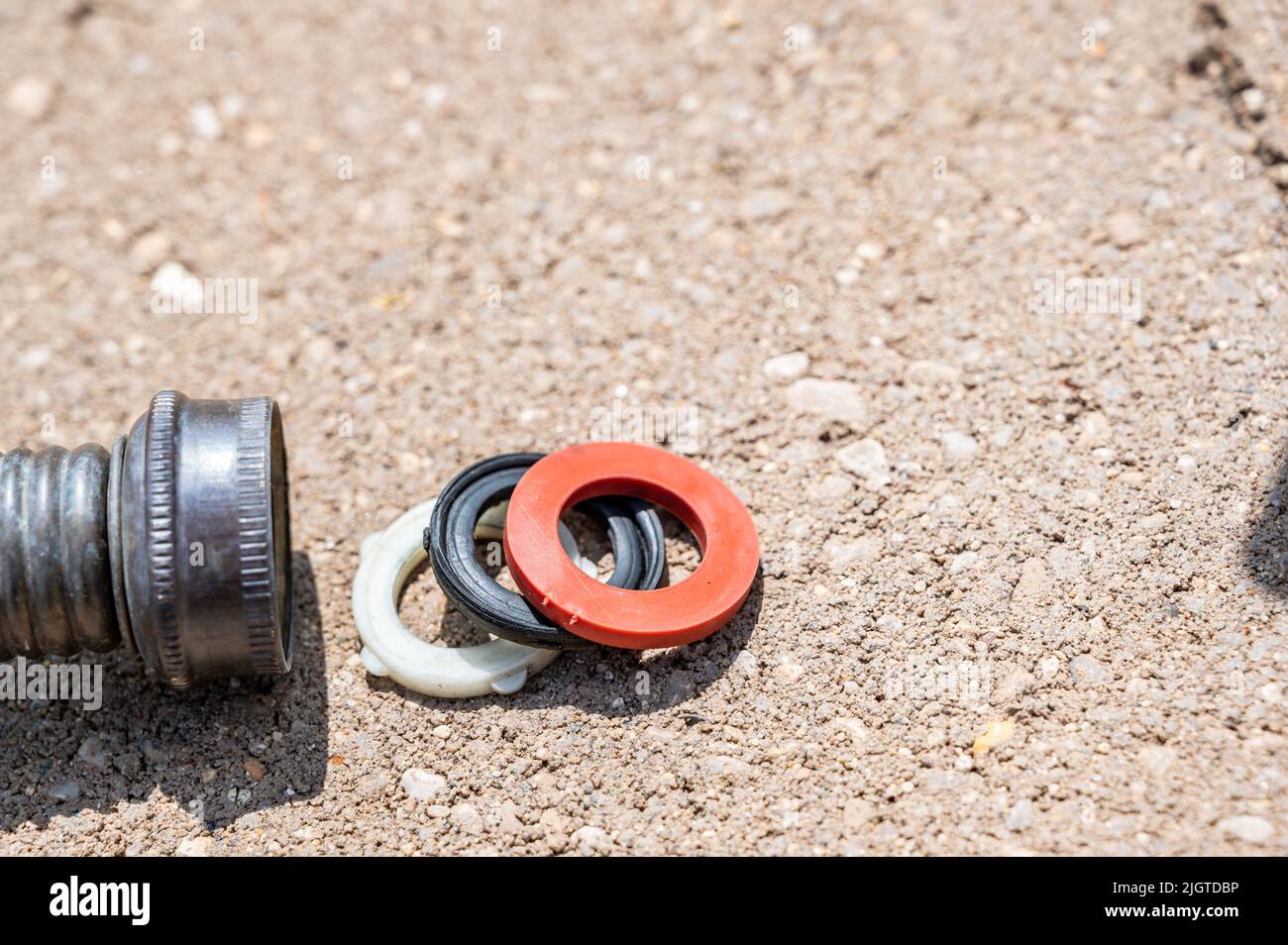 New rubber gasket being replaced in a garden hose female connection to ...