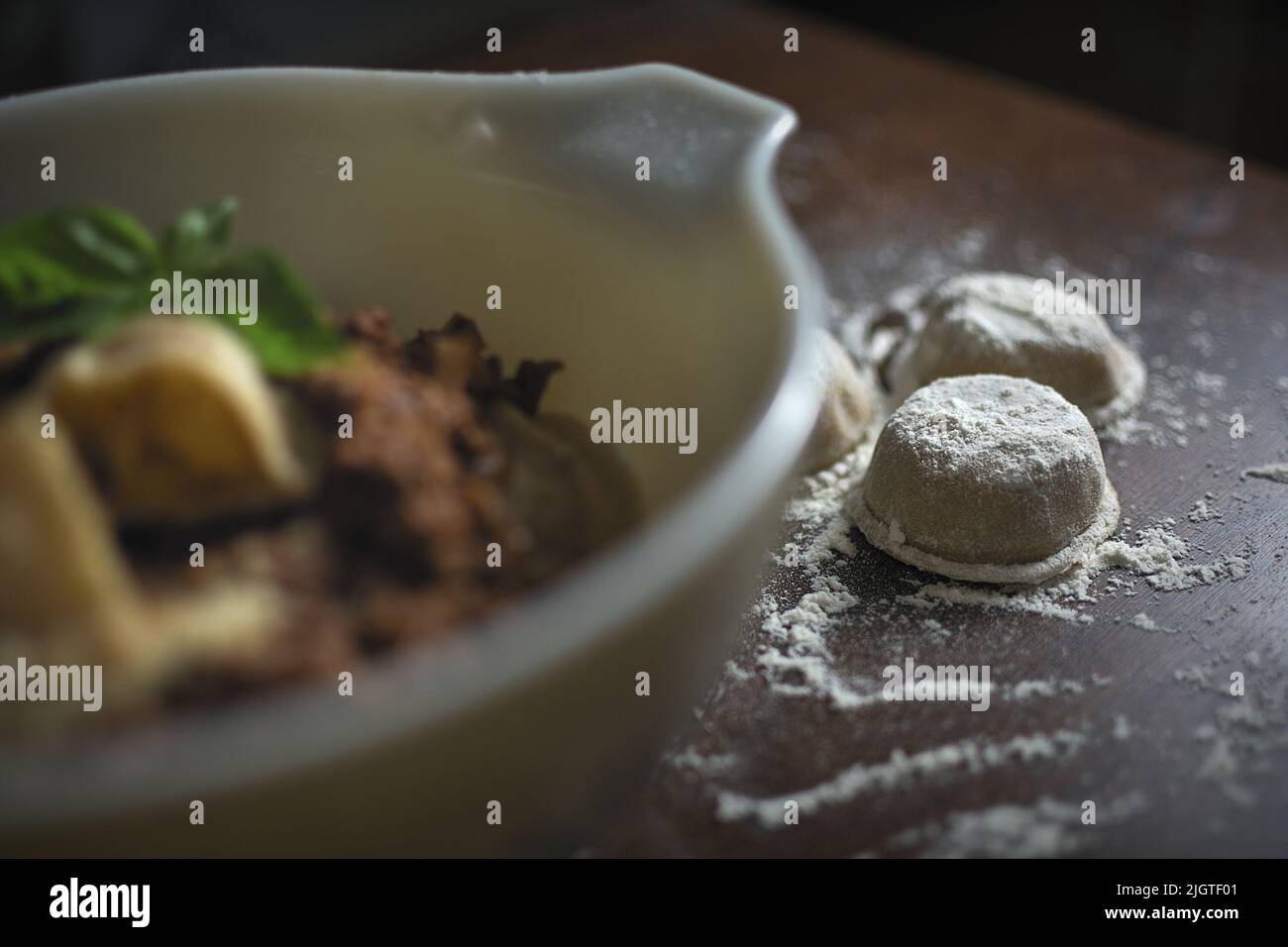 Healthy sourdough big ravioli (aka sorrentinos) over a floured wooden ...