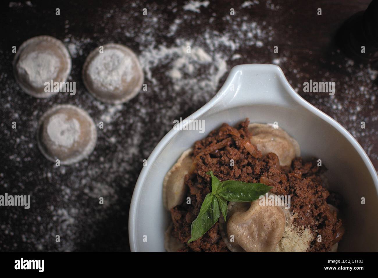 Healthy sourdough big ravioli (aka sorrentinos) over a floured wooden ...