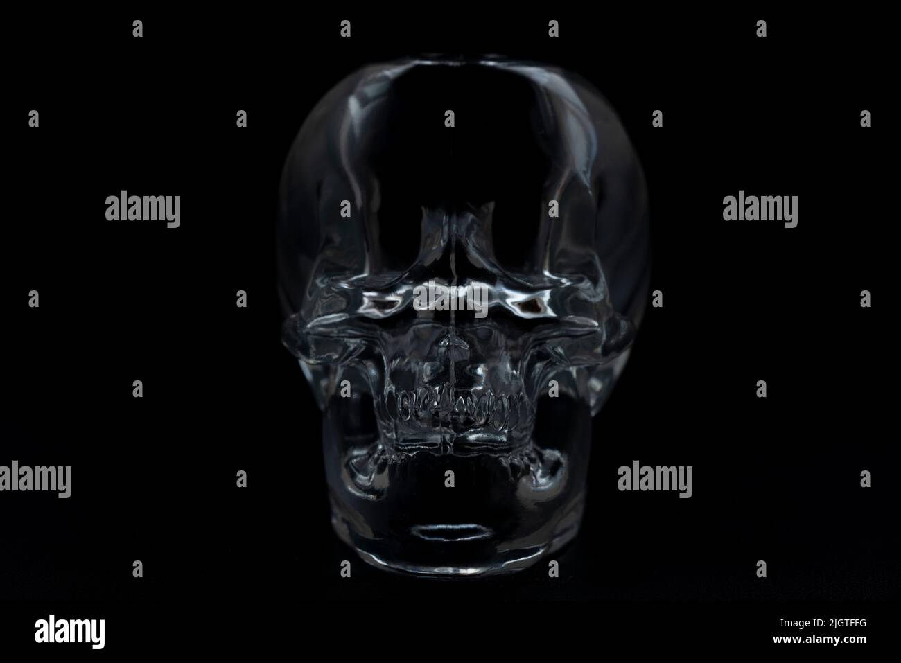 Crystal skull ancient artifact on black background. Front portrait ...