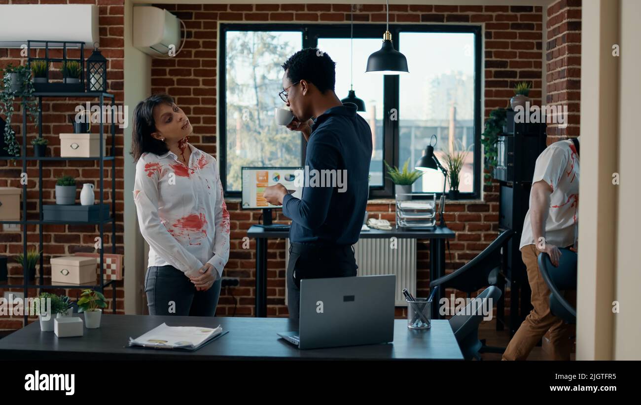 Mindless zombie woman talking with office colleague while scary dead ...