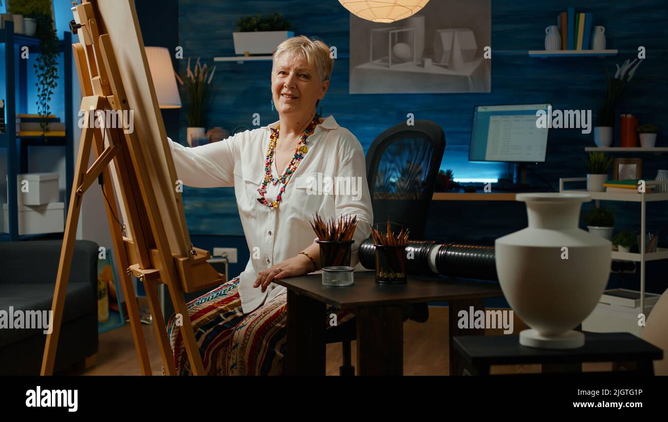 Old artist using vase model to draw authentic masterpiece on canvas ...