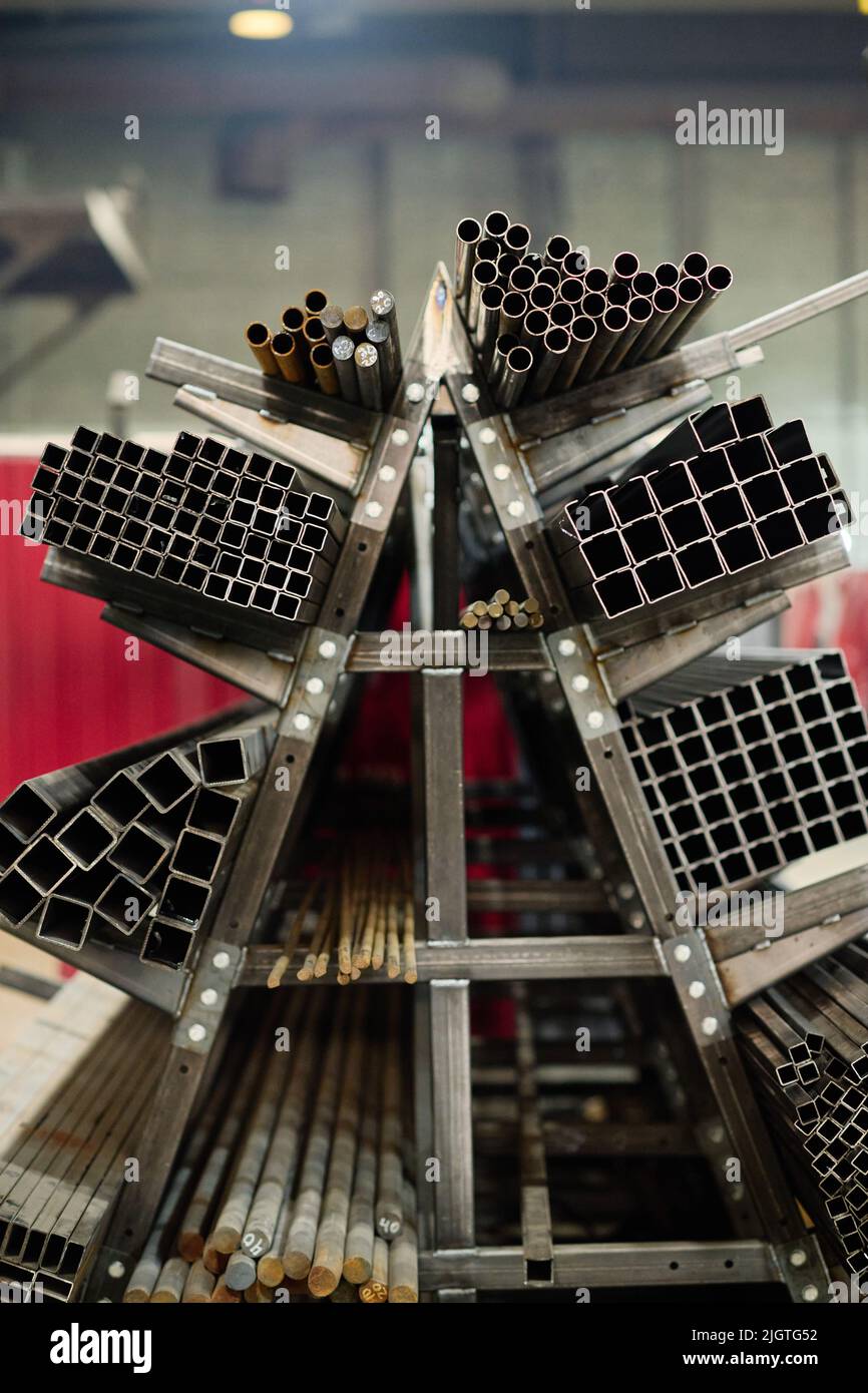 Vertical image of finished metal materials different diameters lying on ...