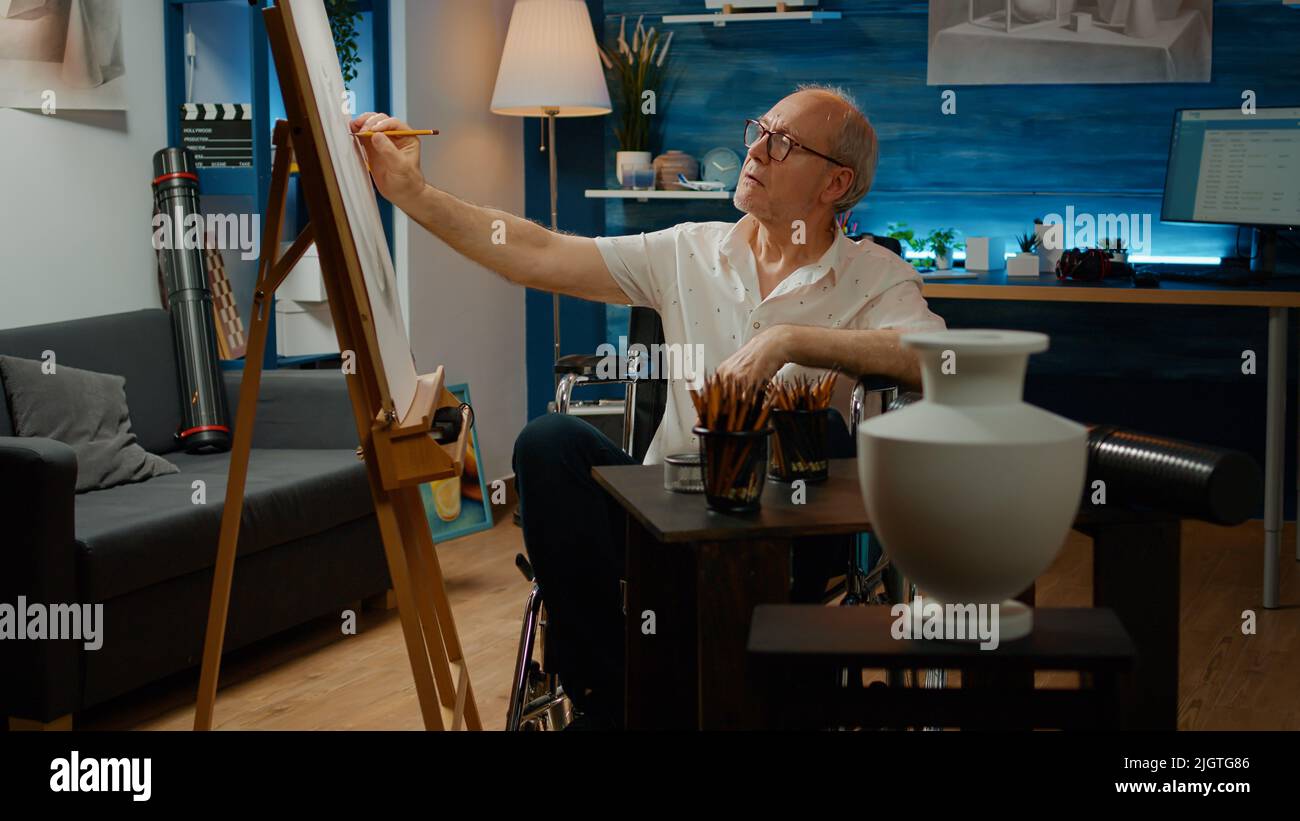 Paralyzed man with health condition drawing modern art model of ...