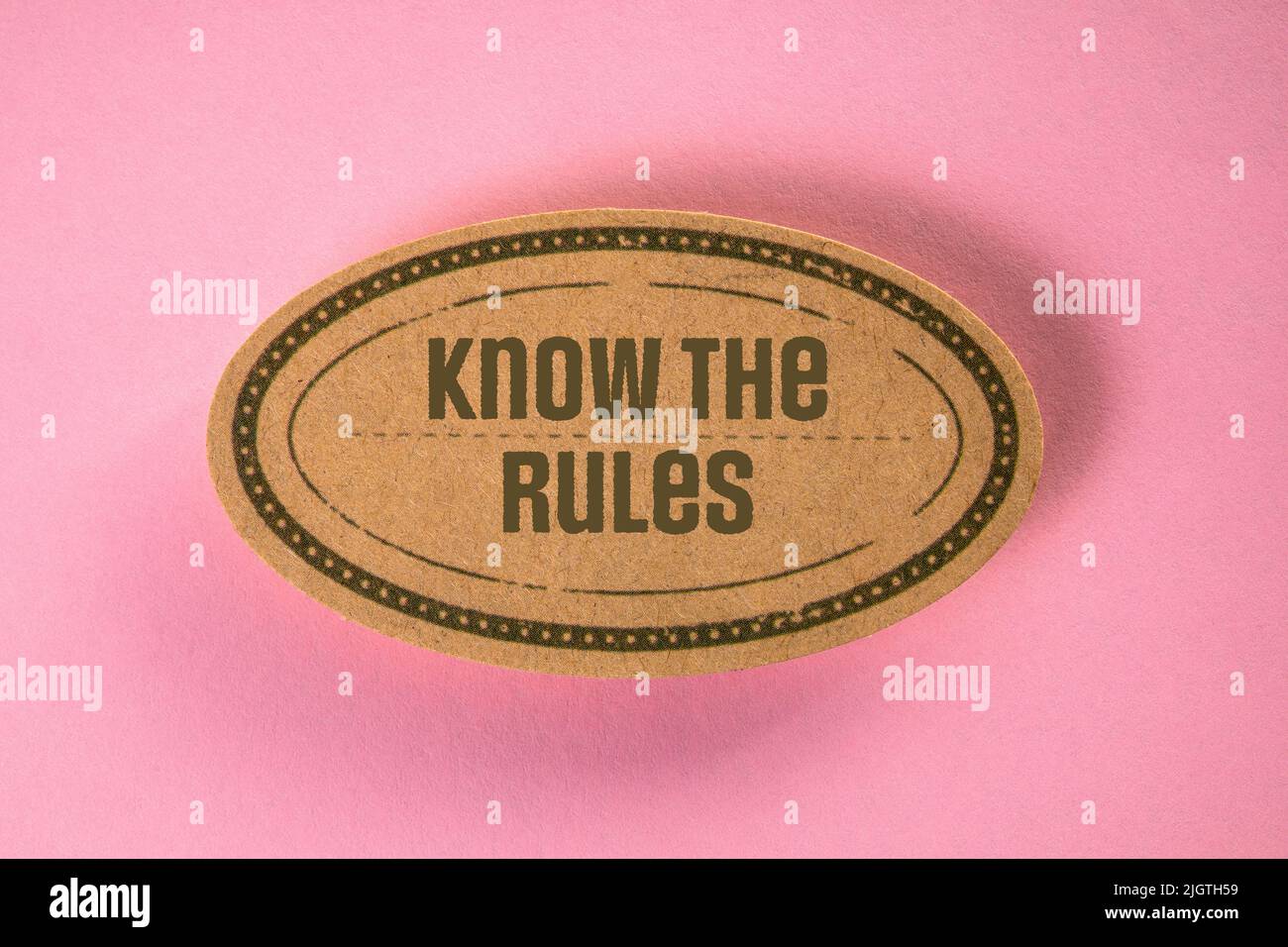 Know the Rules. Text on a decorative label sheet. Pink background Stock ...