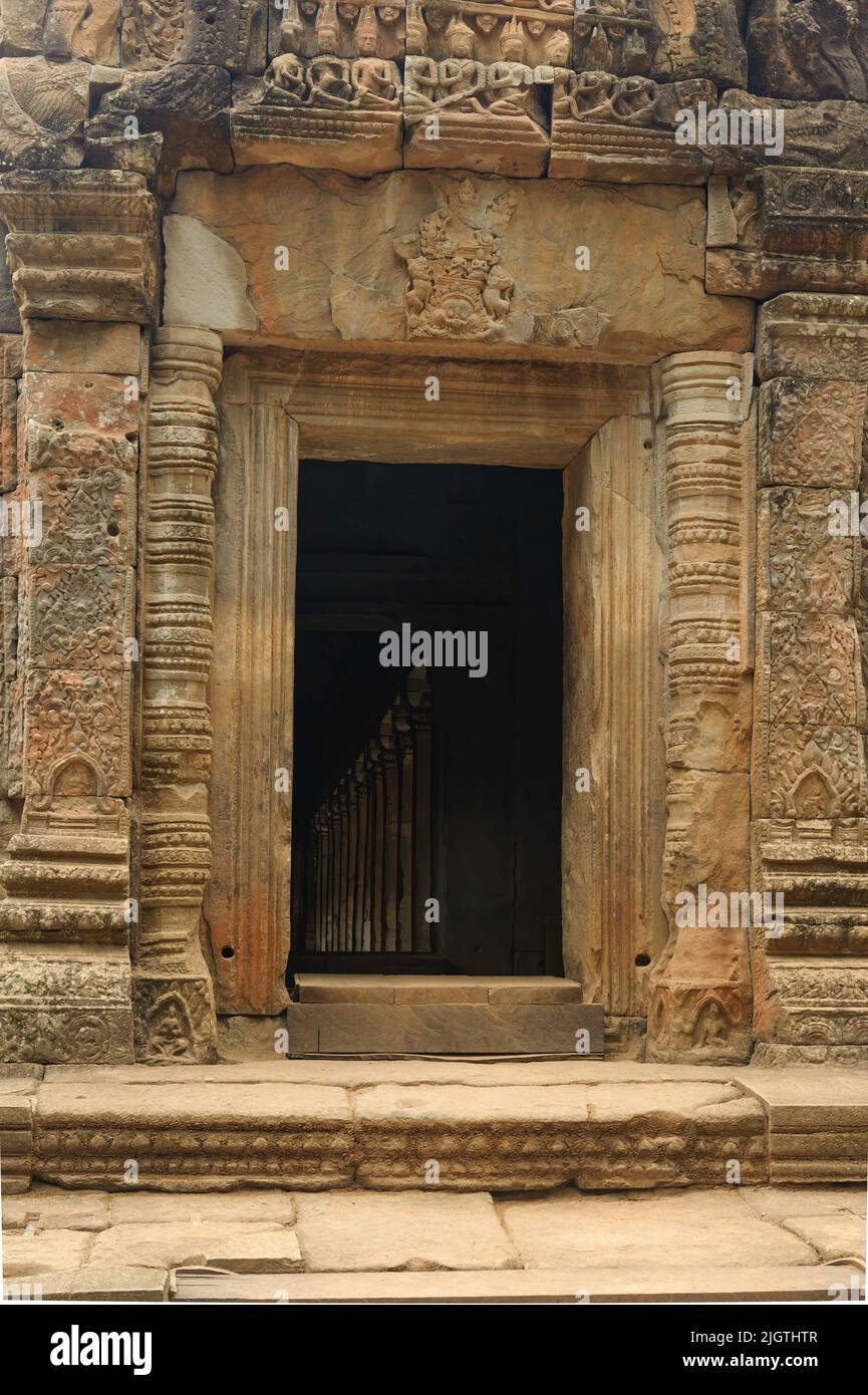The Intricately carved stone entrance to the temple at Ta Prohm, in ...