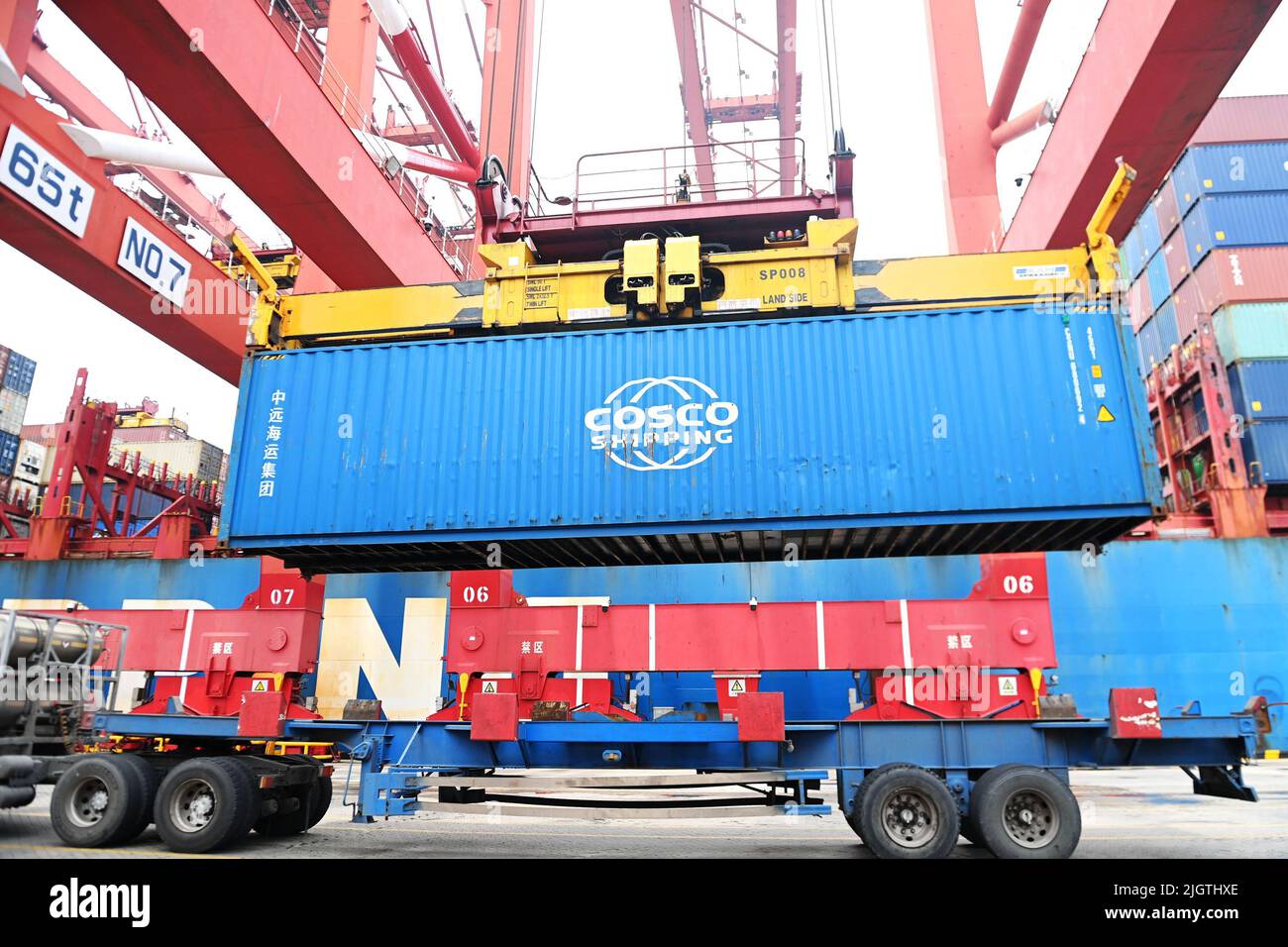 QINGDAO, CHINA - JULY 13, 2022 - Freighters load and unload foreign ...