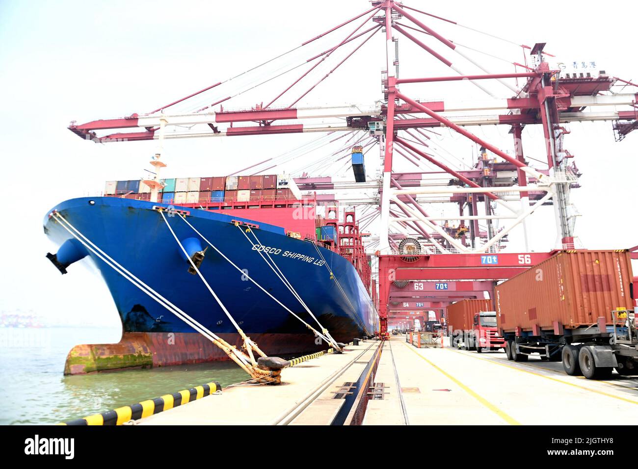 QINGDAO, CHINA - JULY 13, 2022 - Freighters load and unload foreign ...