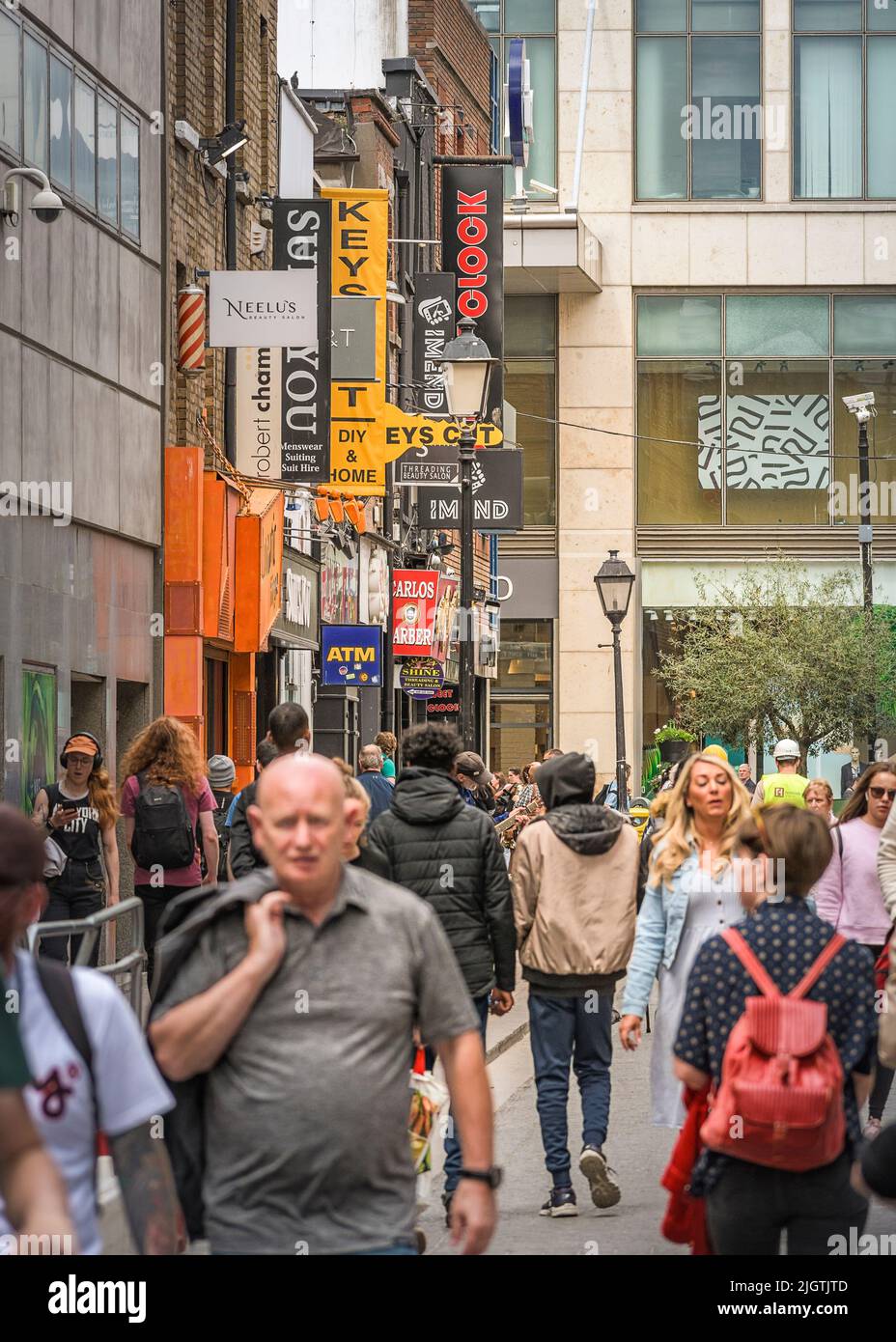 Everyday street scene at the corner of Liffey Street and Henry Street ...