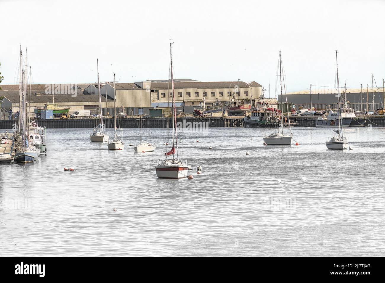 Sailing boats on a mooring at in the area of Arklow port at the estuary ...