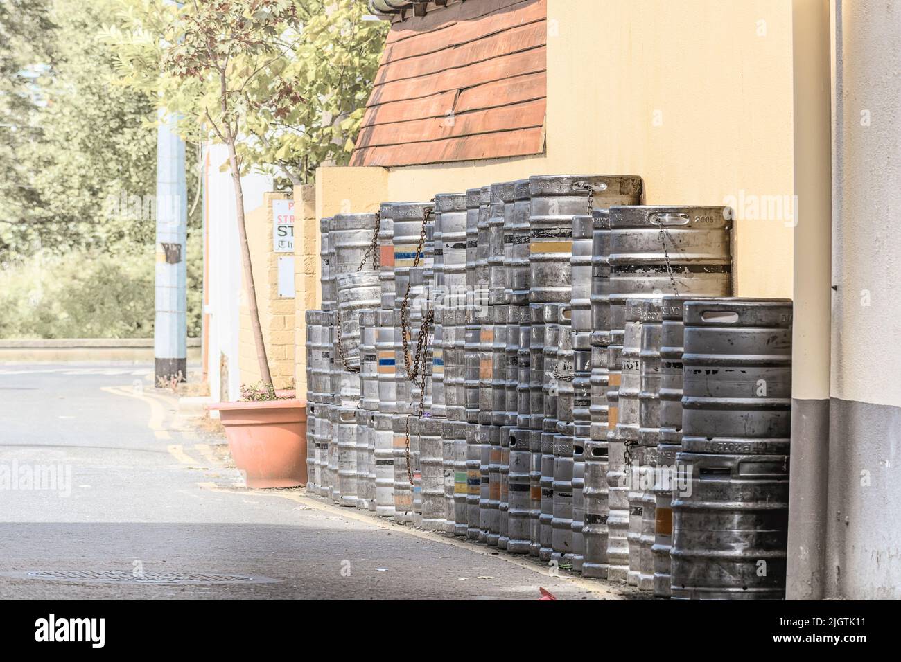 Stack of silverfish metal stainless steel beer, ale, stout kegs outside ...