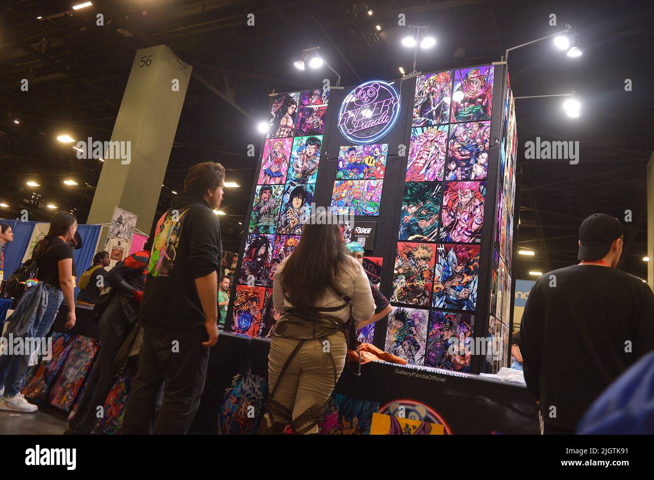 MIAMI BEACH, FL - JULY 09: Fans of SUPERCON look over merchandise at ...
