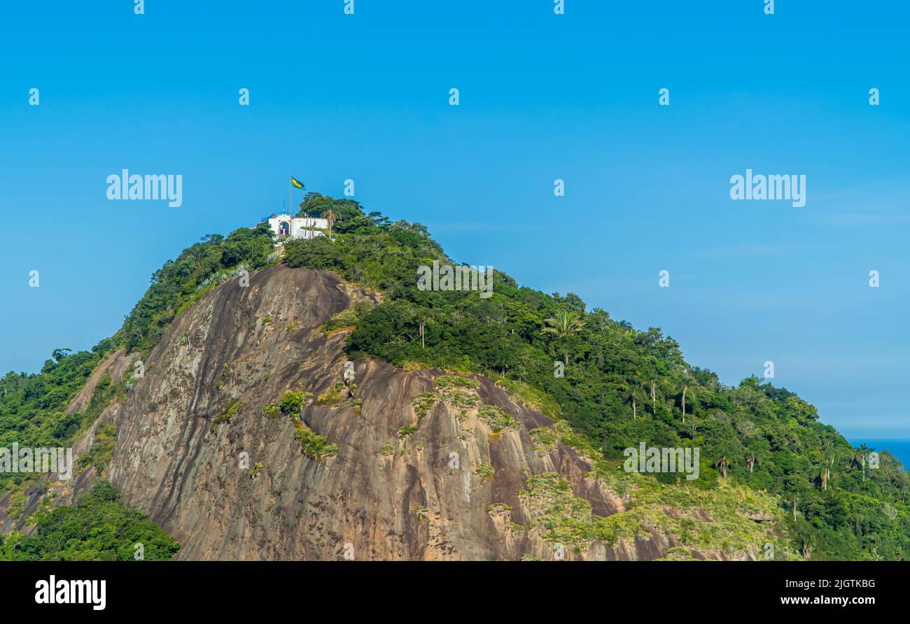 The famous Fort of Leme in Rio de Janeiro and the waving flag of Brazil ...