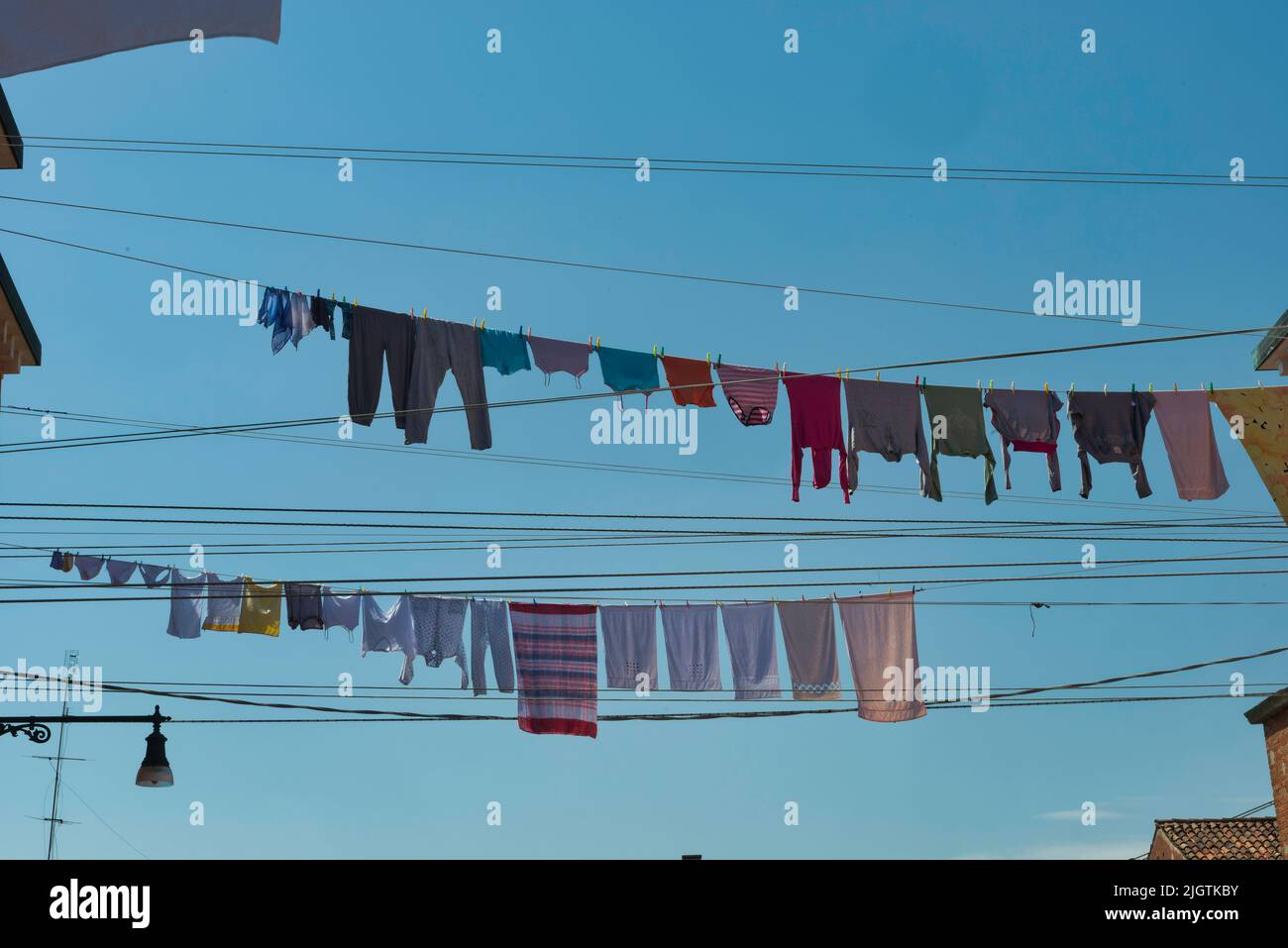 Clothes on wires hi-res stock photography and images - Alamy