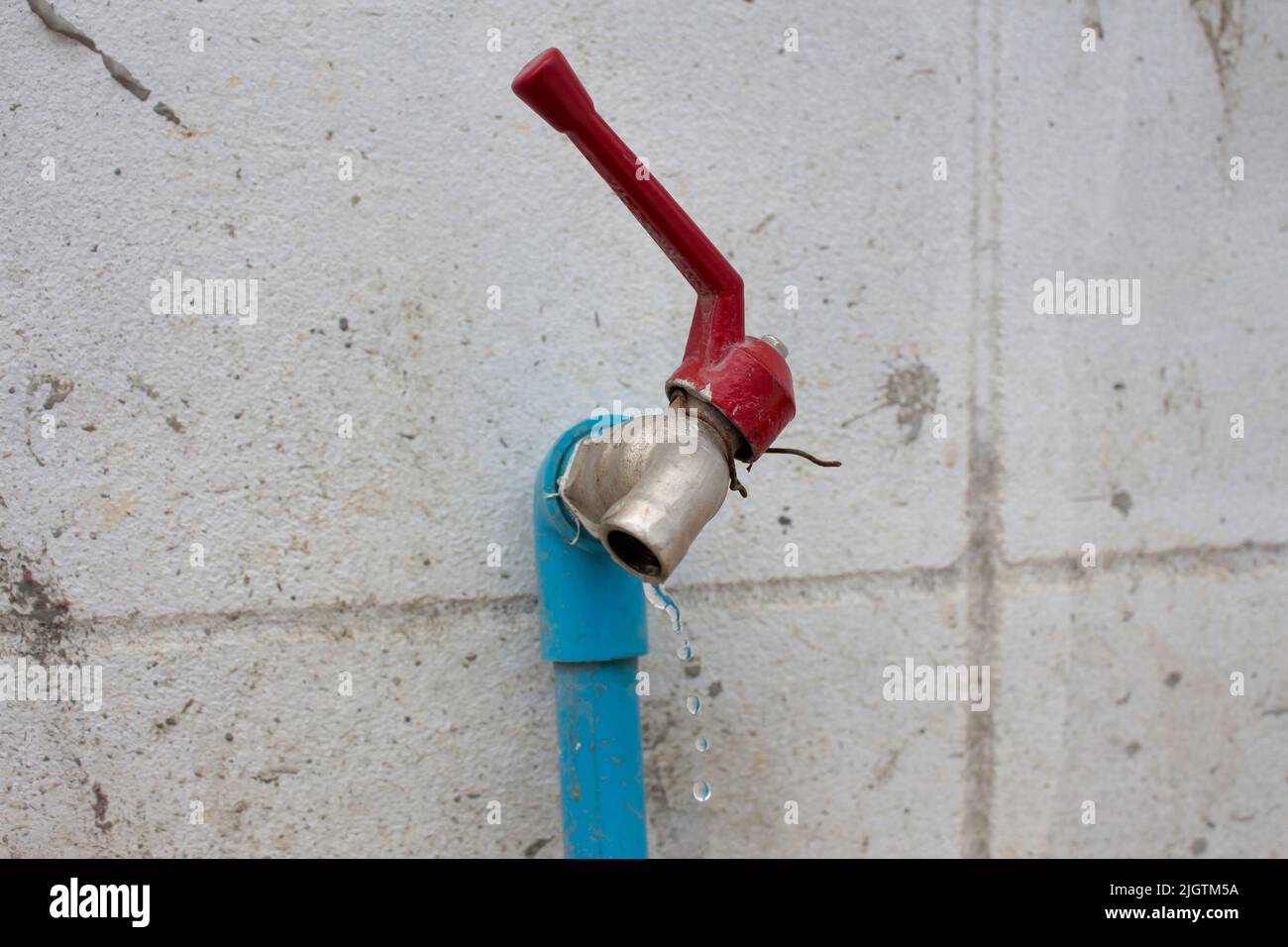old faucet on concrete wall, save the water concept Stock Photo - Alamy