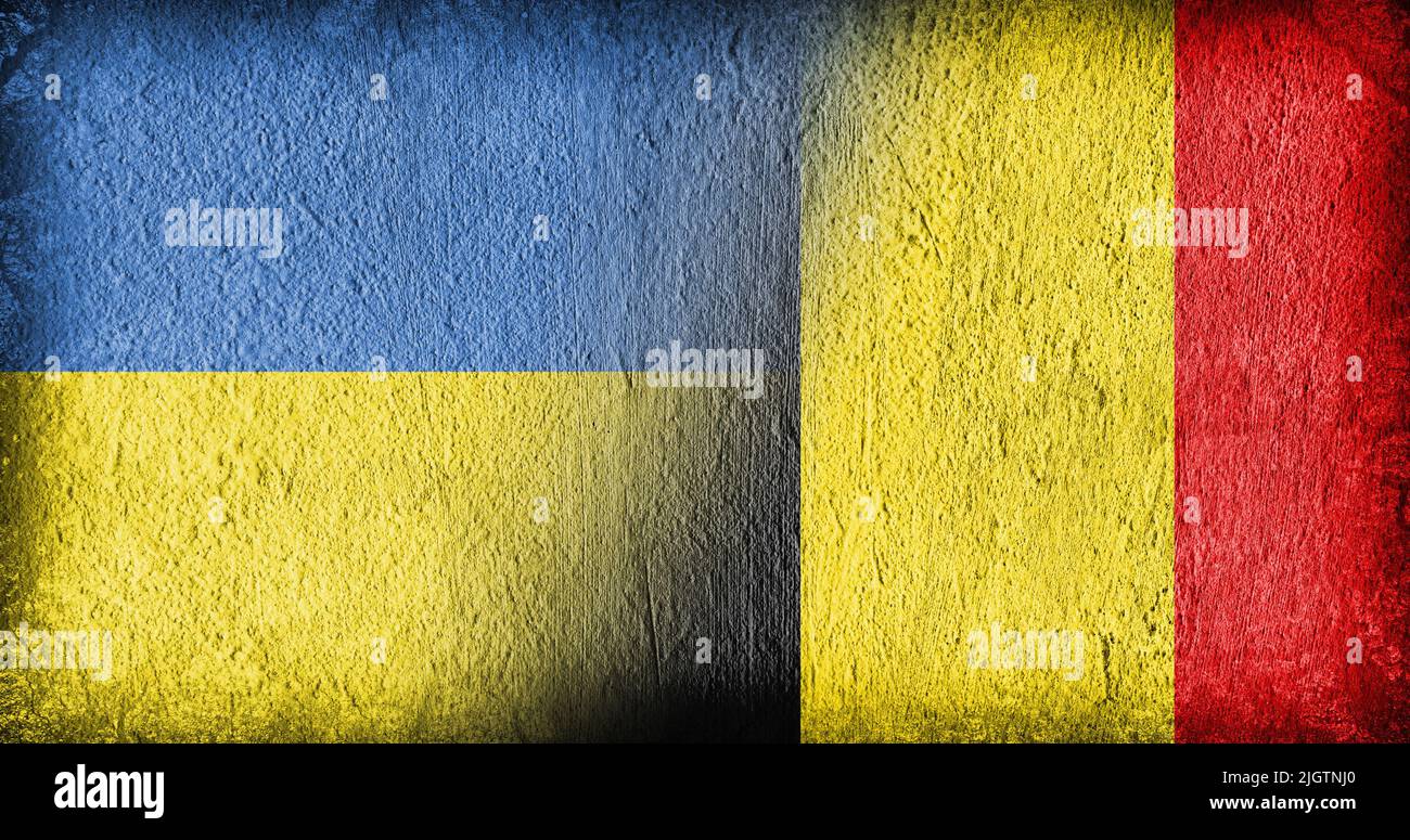 Ukrainian and Belgium flag on concrete, divided in the middle Stock ...