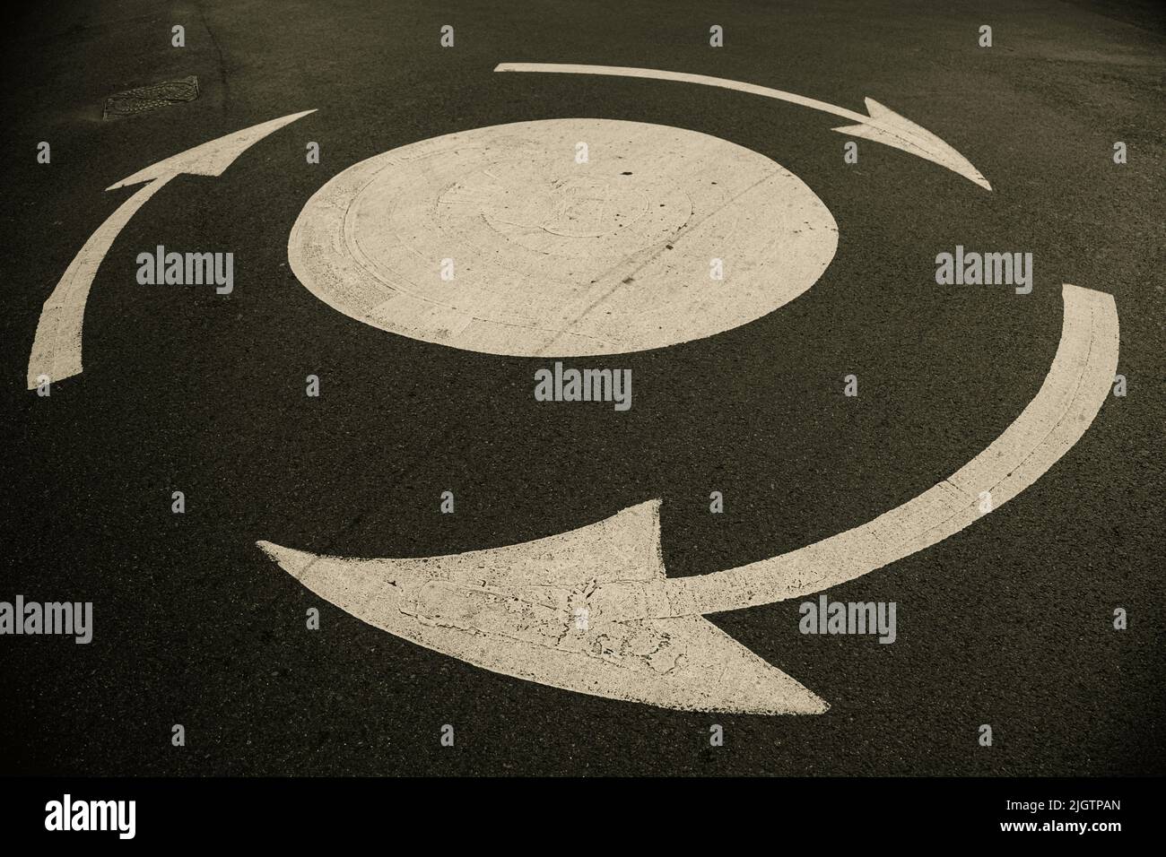 Small painted roundabout on the road Stock Photo - Alamy