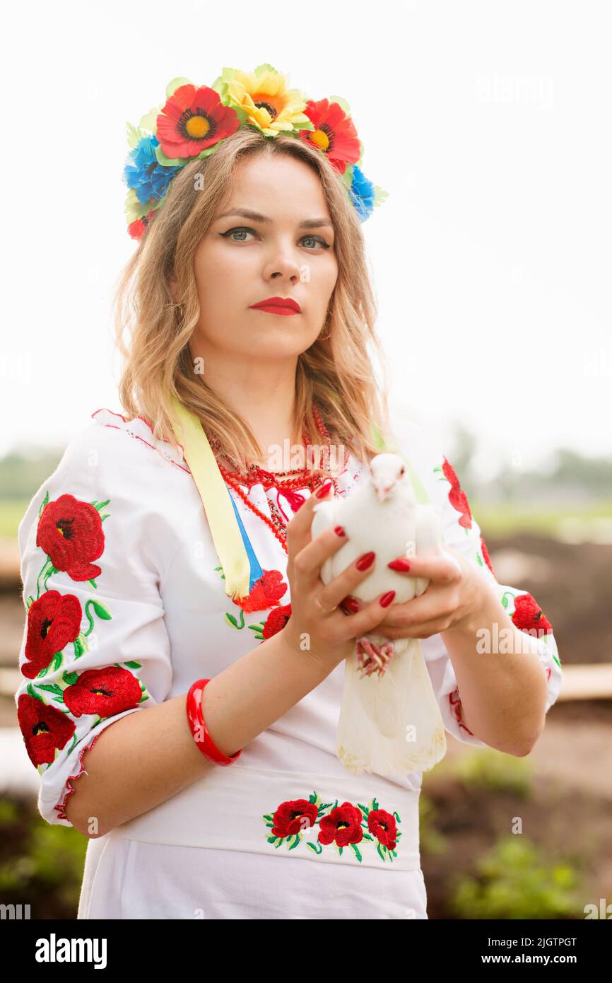 A beautiful Ukrainian woman in Ukrainian national embroidered dress ...
