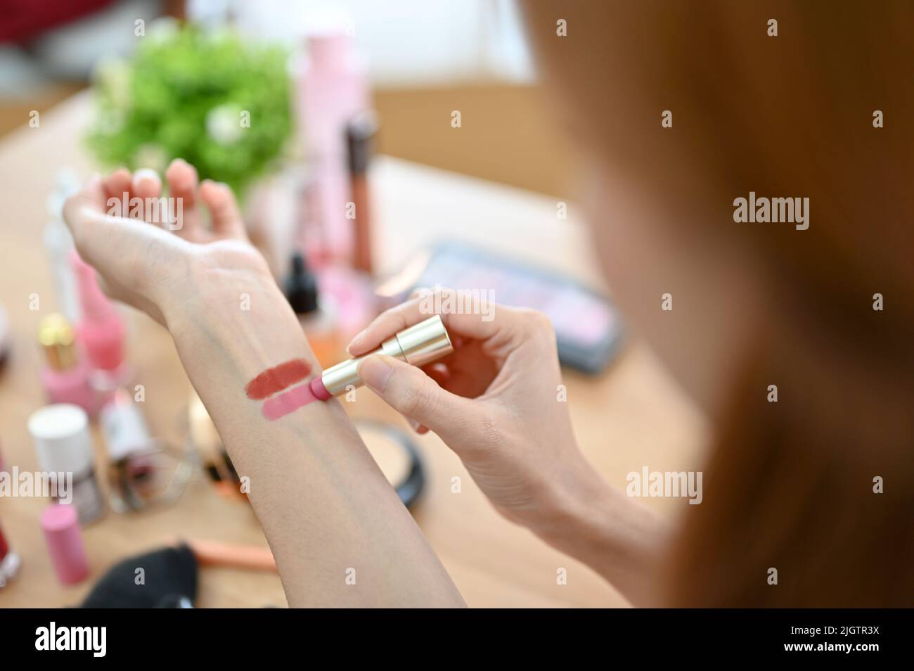 Close-up hands image, Female beauty blogger testing a lipstick on her ...