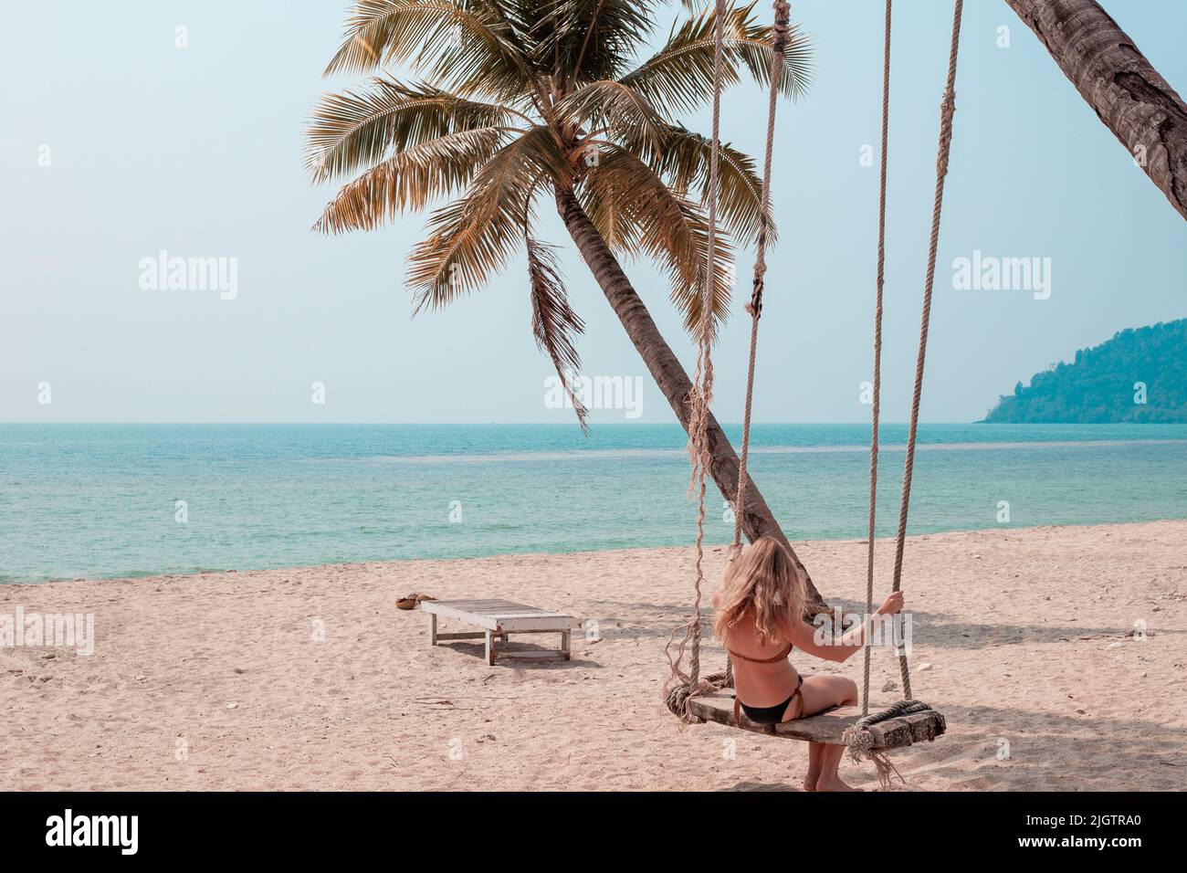 Girl swinging on a rope bali hi-res stock photography and images - Alamy