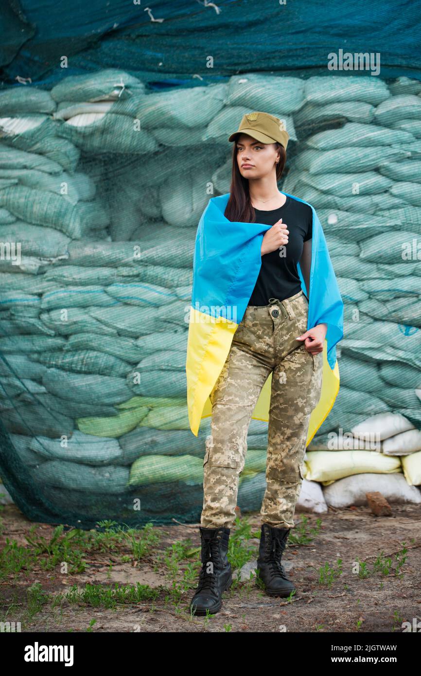 Ukrainian girl in the uniform of the armed forces of Ukraine near the ...