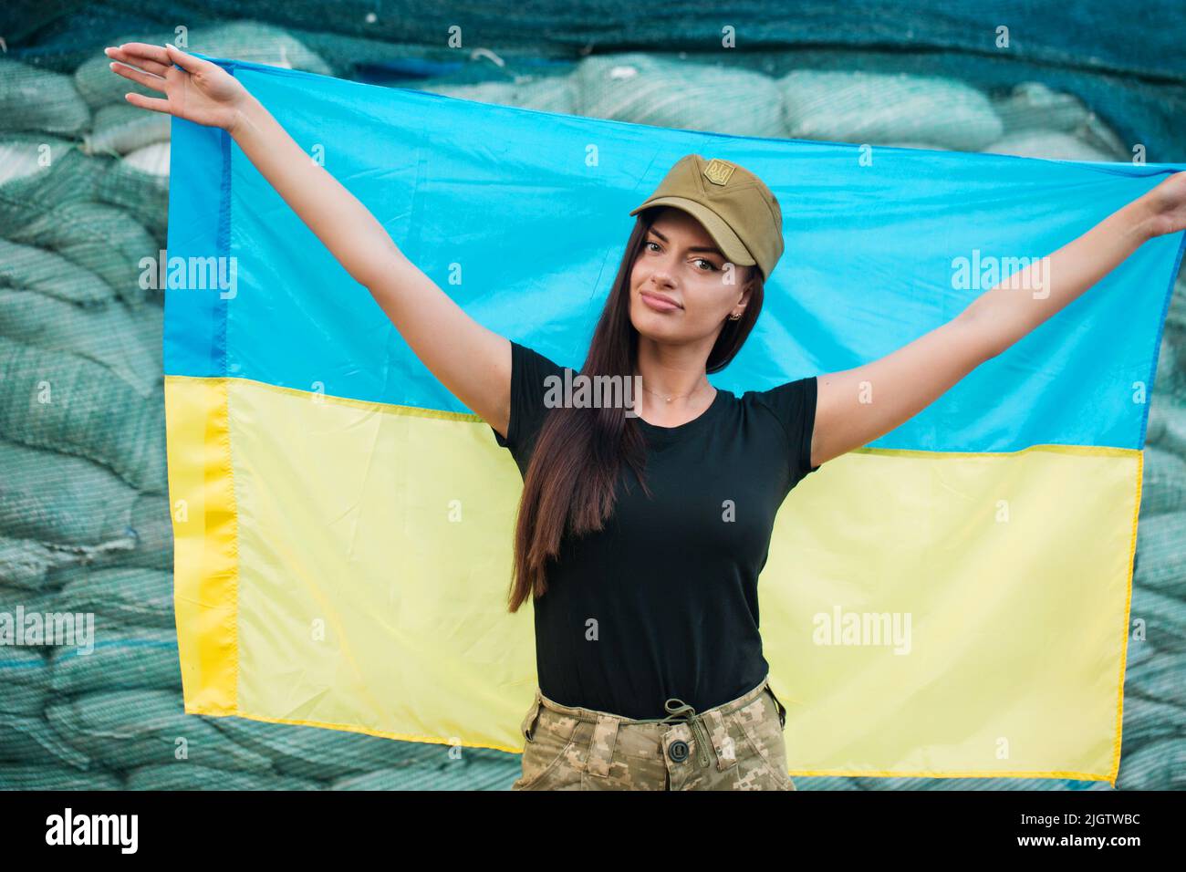 Ukrainian girl in the uniform of the armed forces of Ukraine near the ...