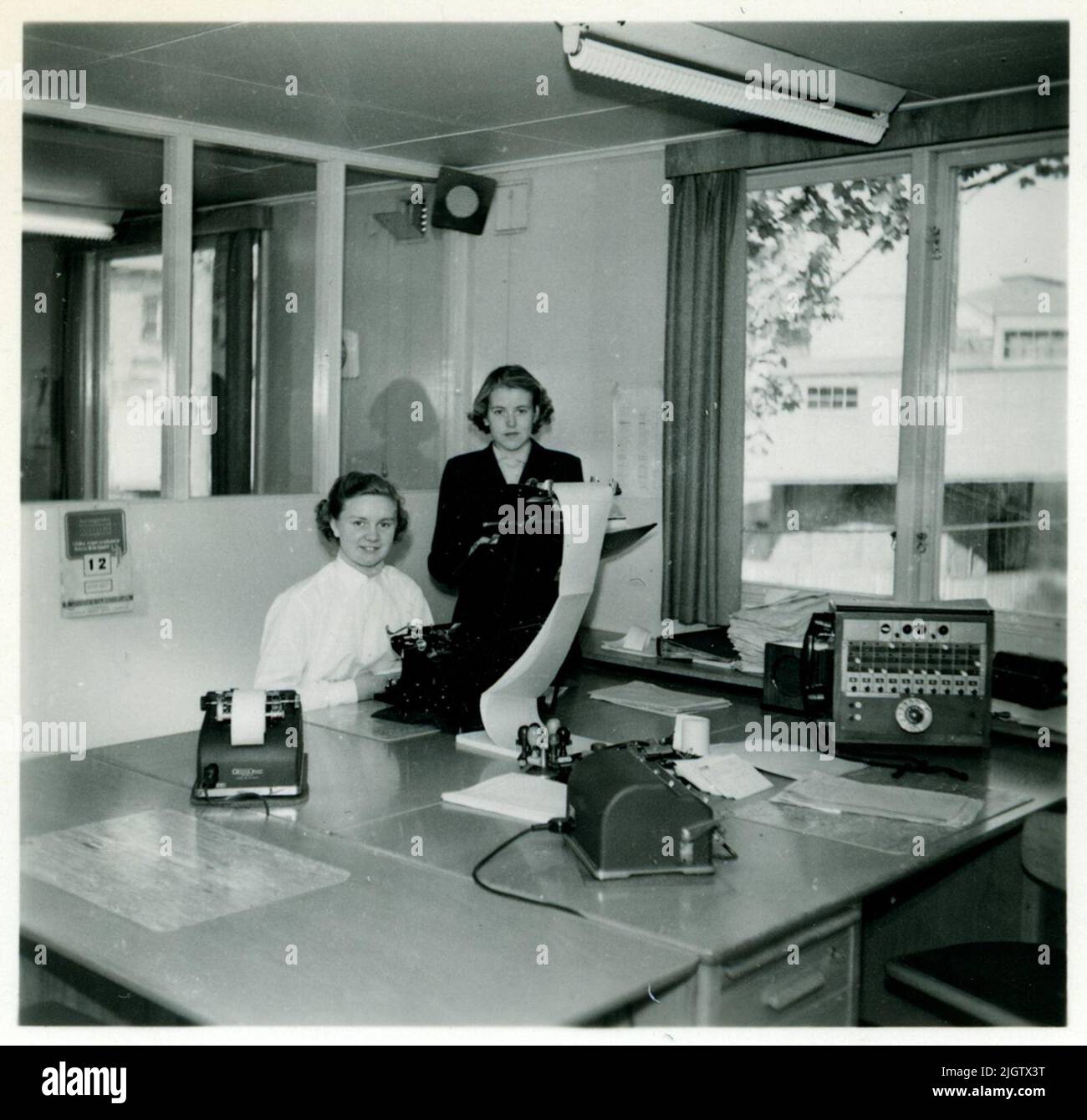 Two of the people who worked at Monark's office. One woman sits down at ...