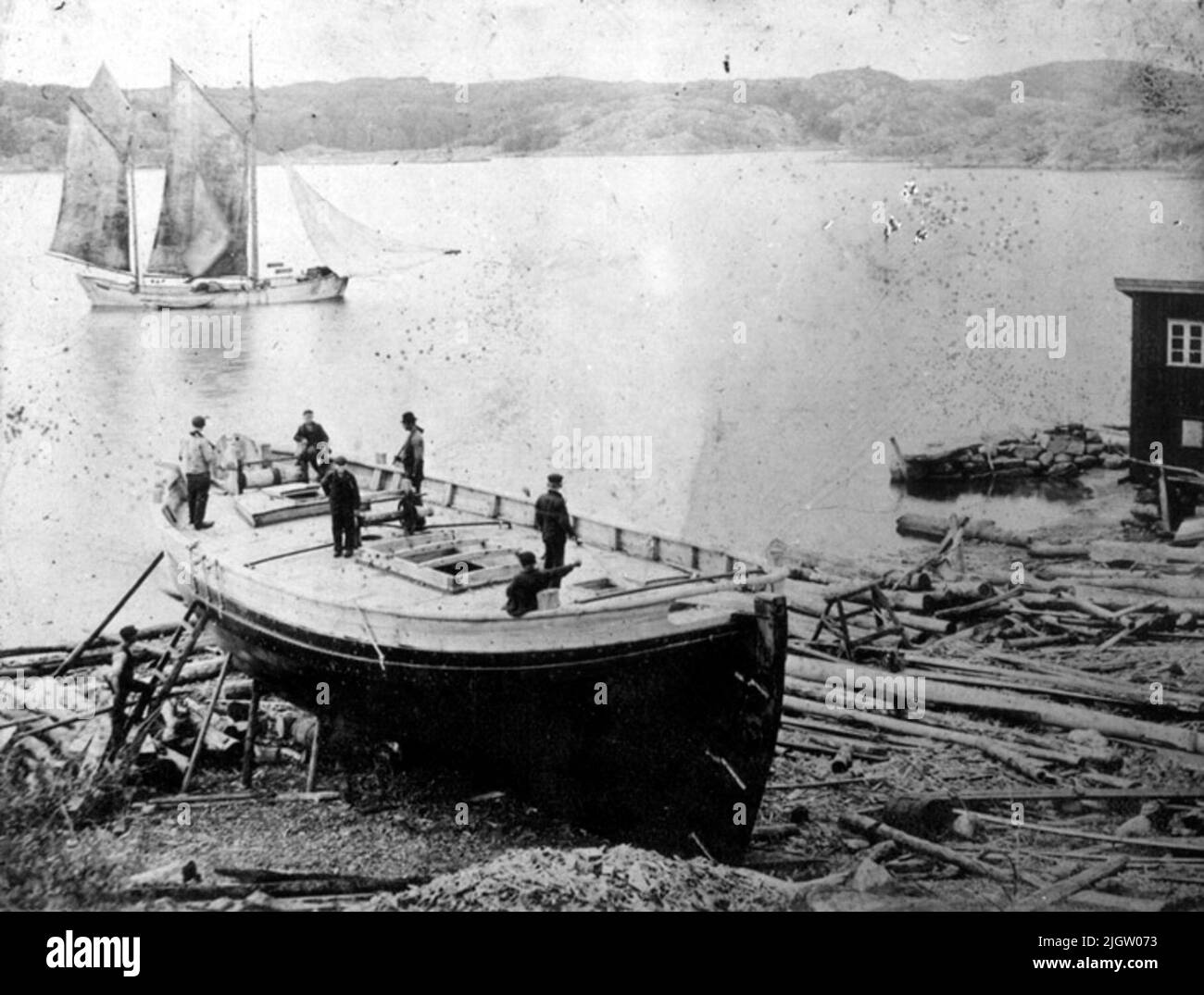 Written on the back: Tile building ready for launch. Buyer boat for sun ...