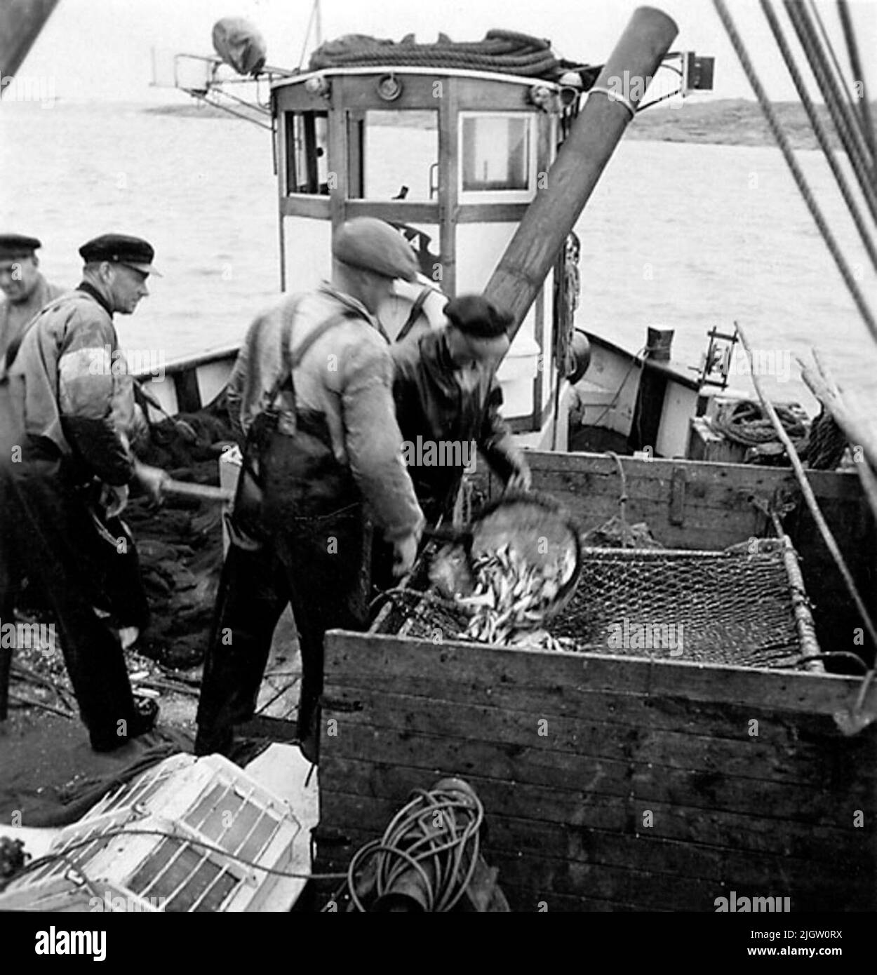 Loading fishing boat Black and White Stock Photos & Images - Alamy