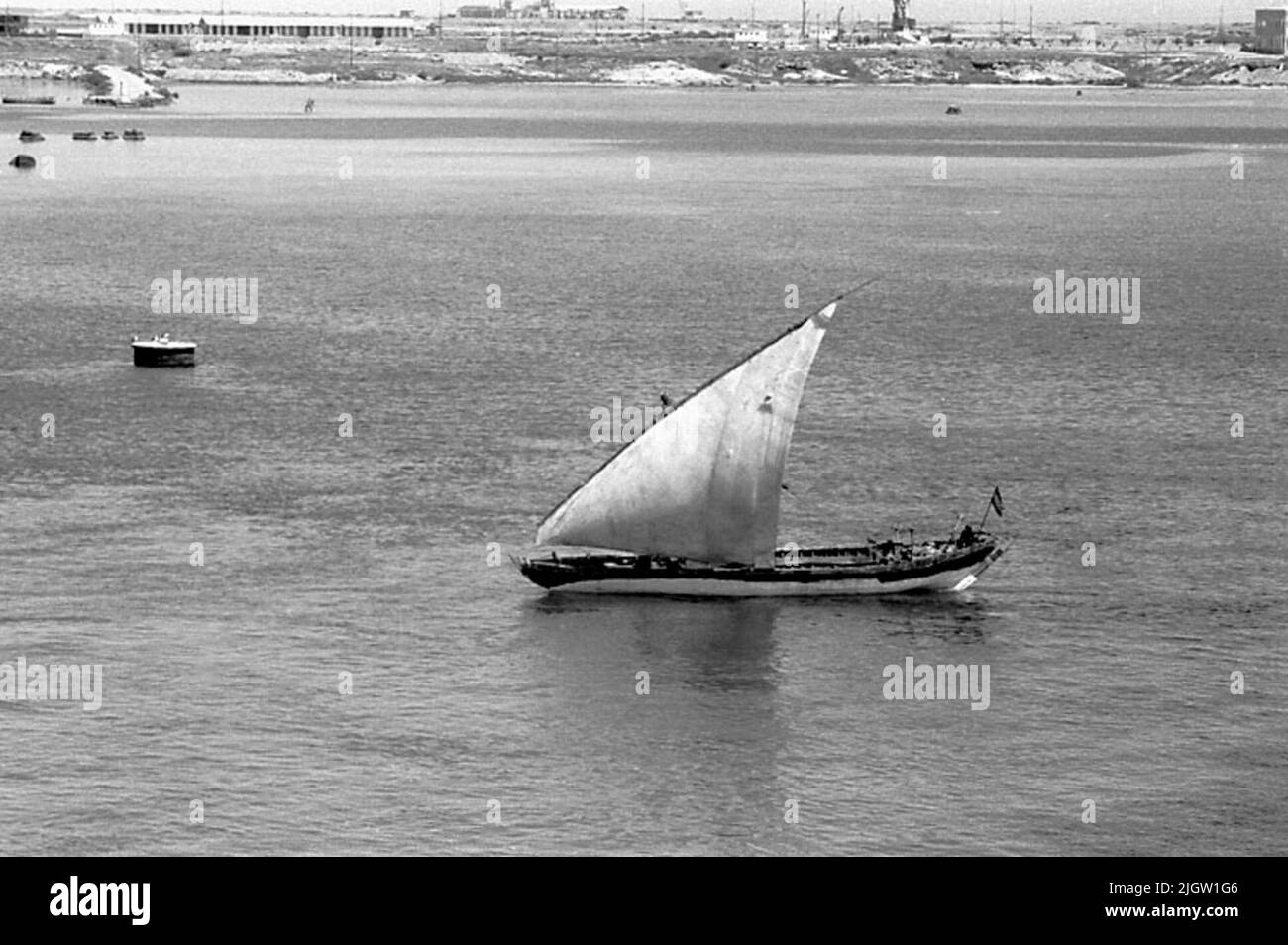 The photo taken about 1961-08-30. A sailboat sails in a sea bay. Inside ...
