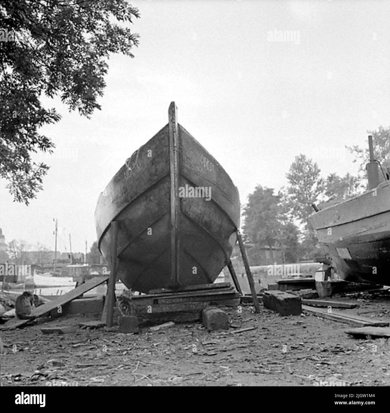 A boat is located in a shipyard for service/completion. In the ...