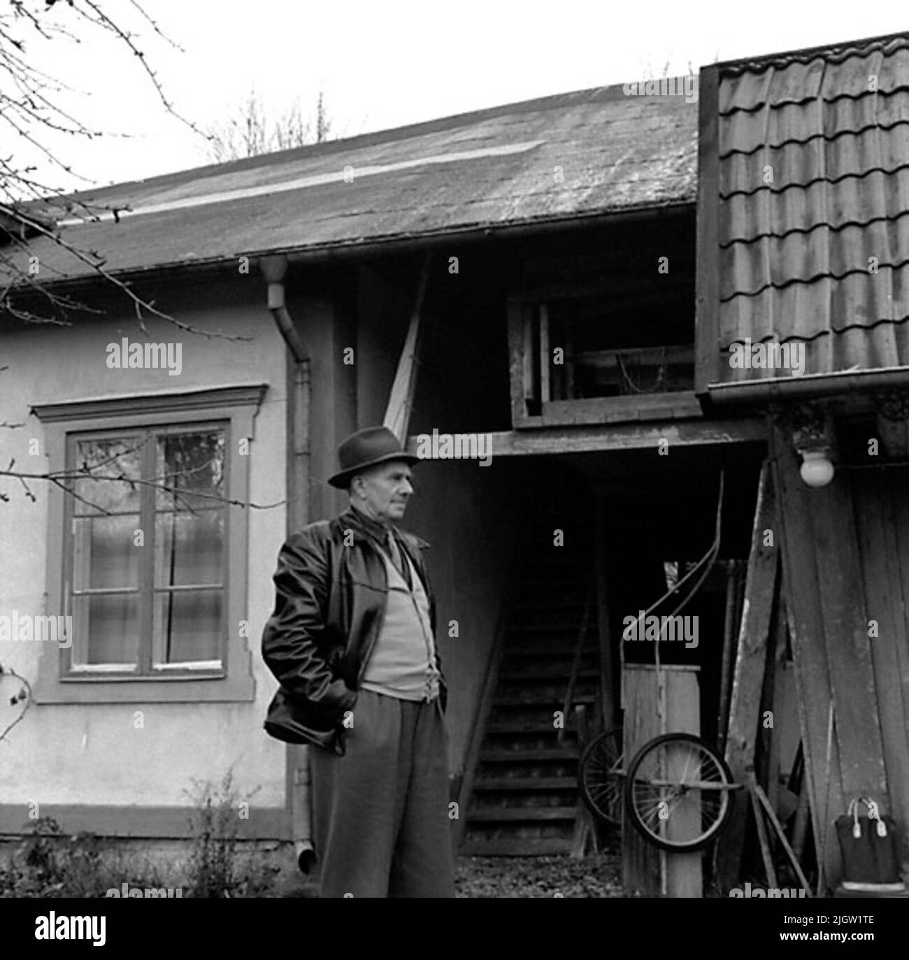 A man stands outside a residential building Stock Photo - Alamy