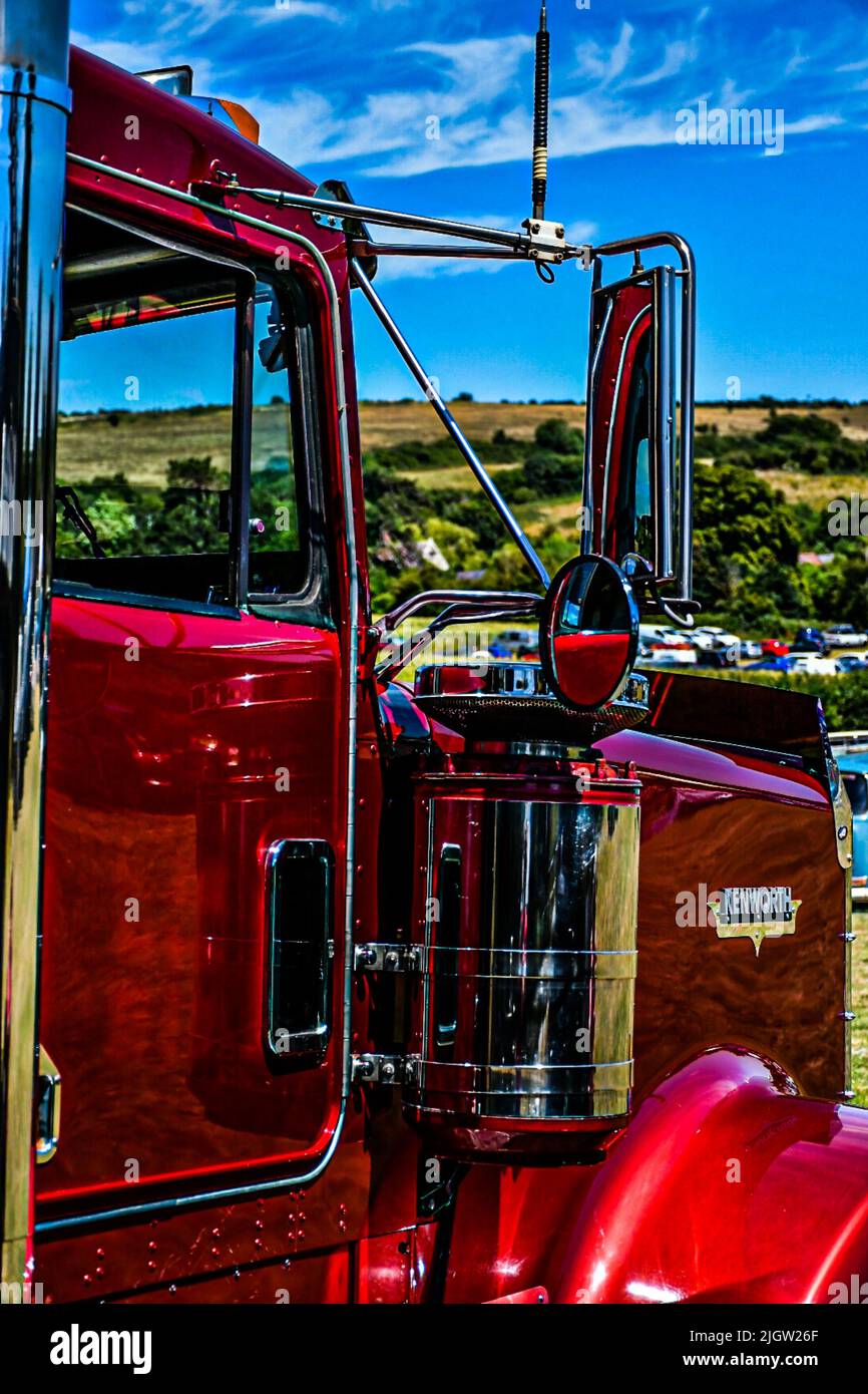 The vertical close-up shot of a red Kenworth W900 classic car parked ...