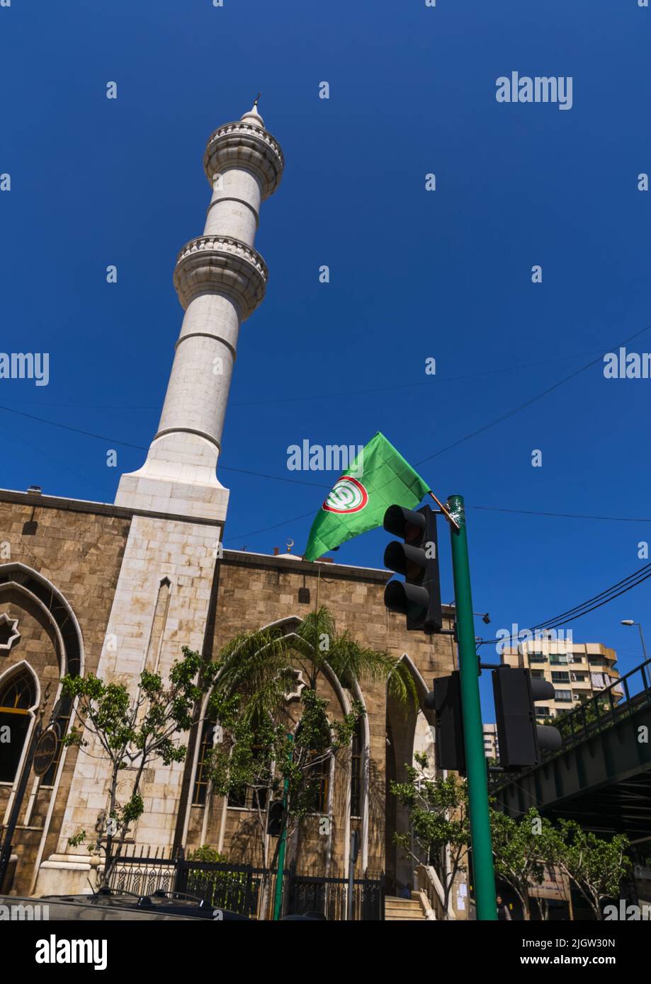 Amal Movement party flag near a mosque in Basta quarter, Beirut ...