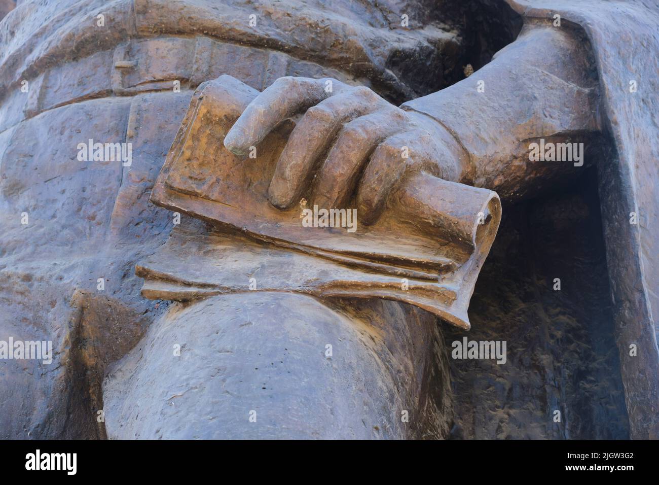 A bronze statue of a standing Erkin Vohidov, famous writer and poet ...
