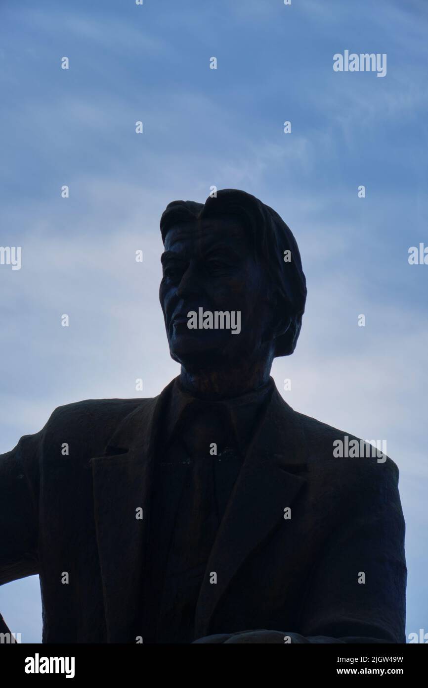 A bronze statue of a sitting Ibrayim Yusupov, famous writer and poet ...