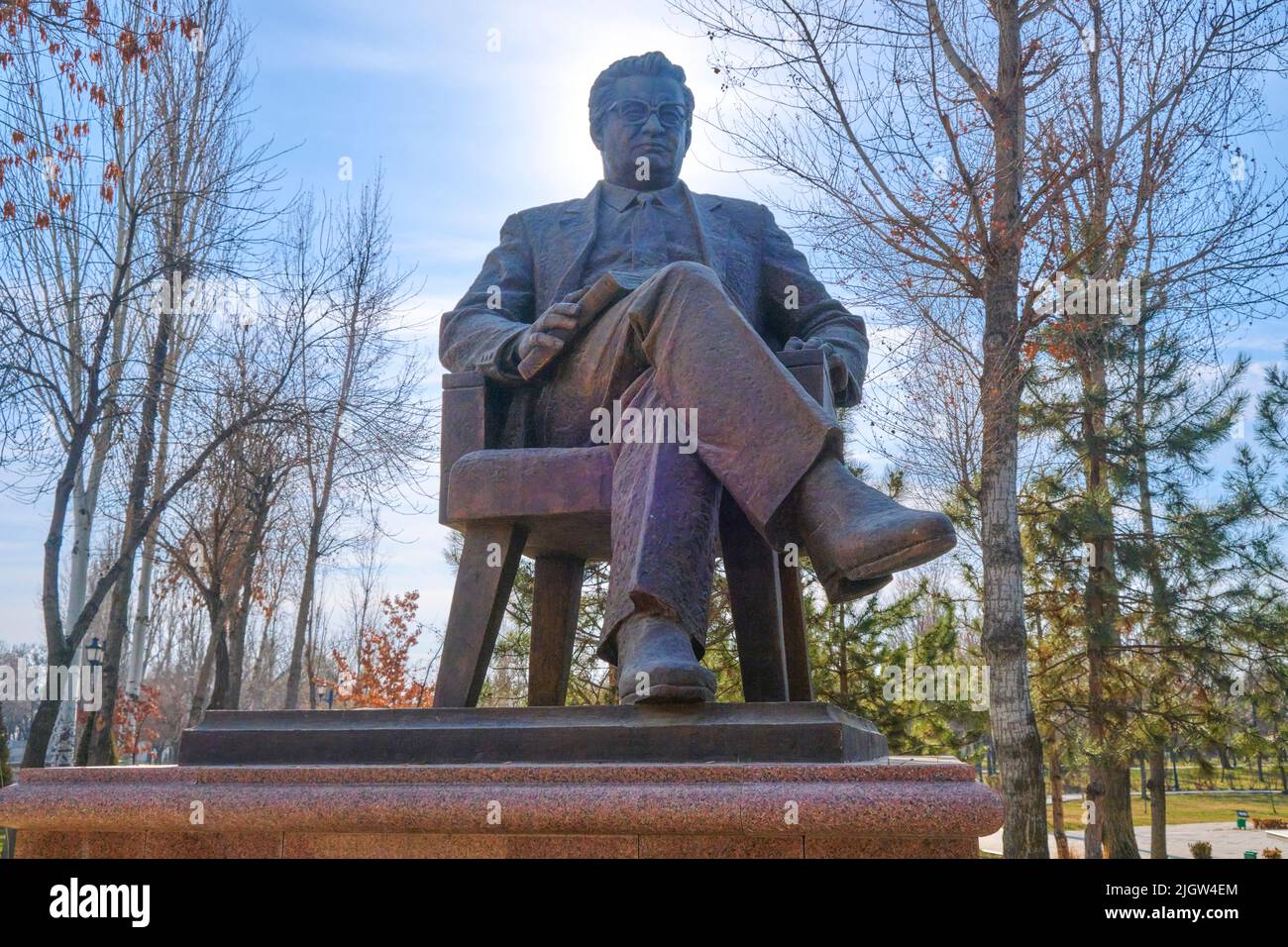 A bronze statue of a sitting Maqsud Shayxzoda, famous writer. At ...