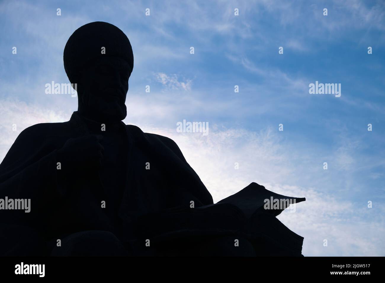 A bronze statue of a sitting Ogahiy, famous writer and critic. At ...