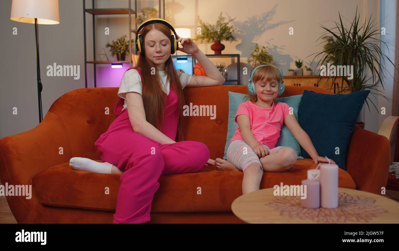 Relaxed sisters dancing in headphones hi-res stock photography and ...