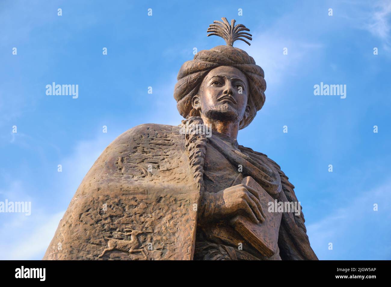 A bronze statue of a standing Bobur, famous leader and who started the ...