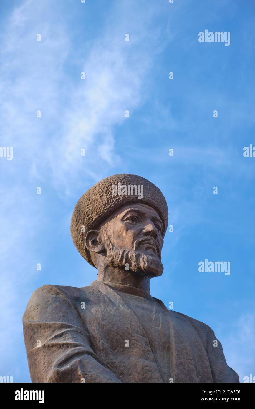 A bronze statue of a standing Berdaq, famous writer and poet. At ...
