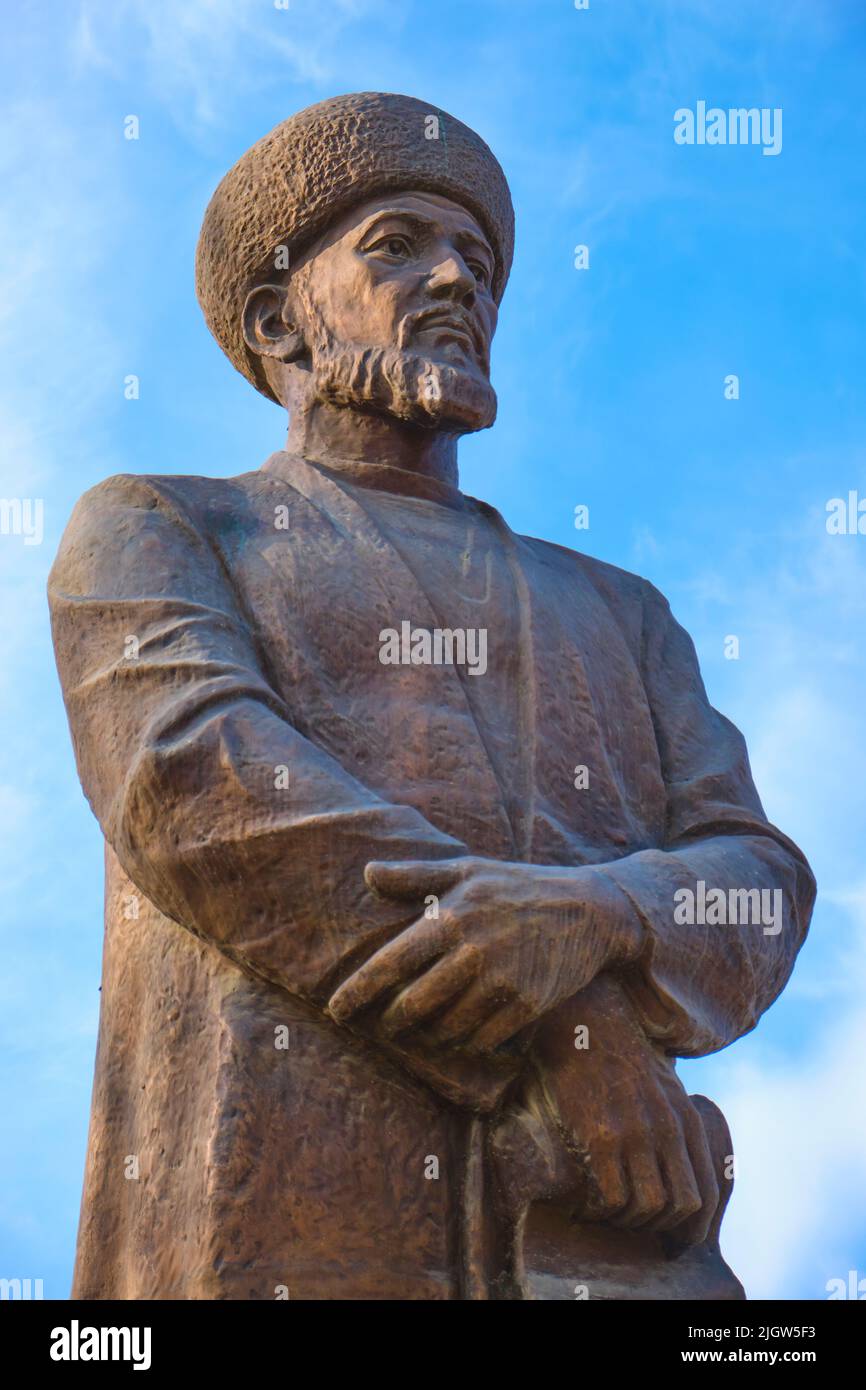 A bronze statue of a standing Berdaq, famous writer and poet. At ...