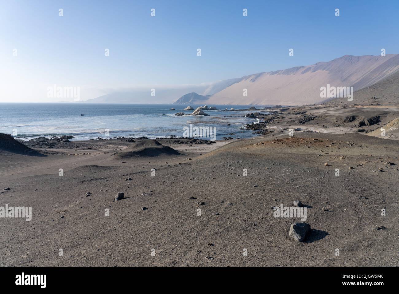 Giant sand dunes slope down from the Coast Range to the Pacific Ocean ...