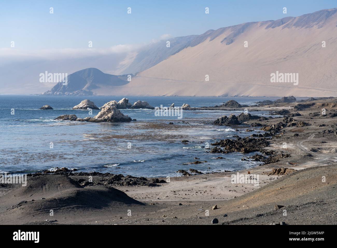 Giant sand dunes slope down from the Coast Range to the Pacific Ocean ...